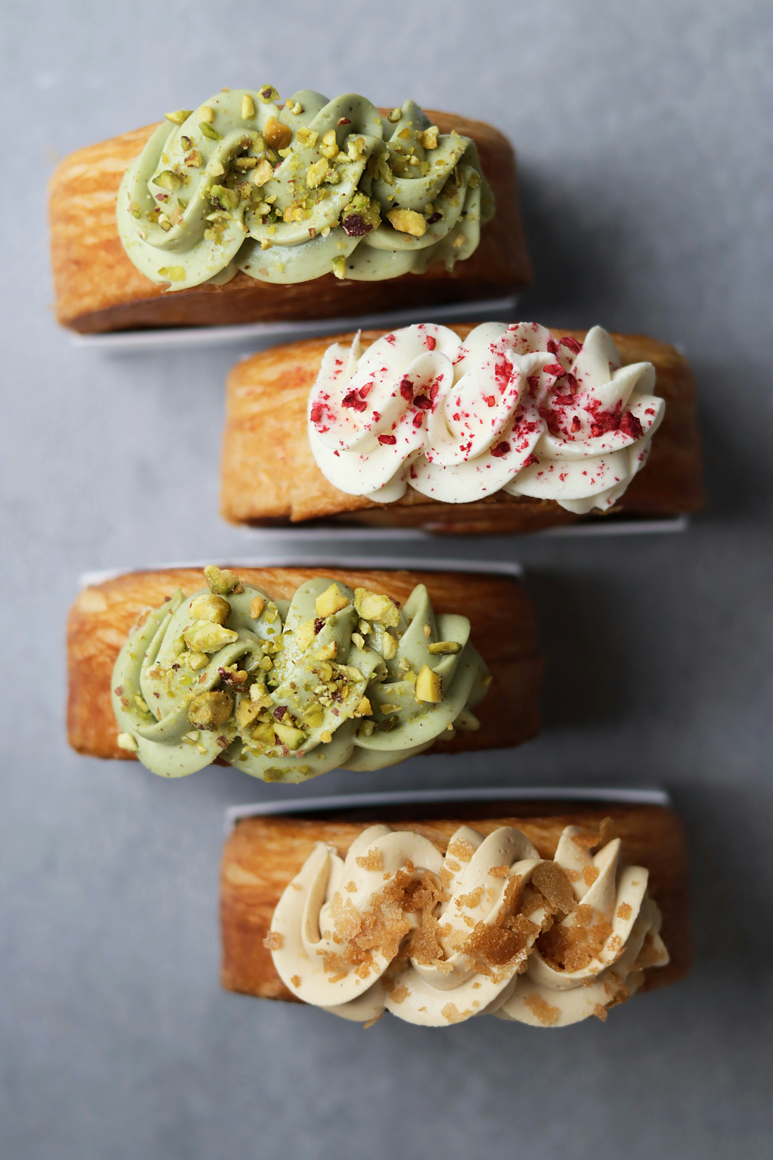 Four pieces of bread with different toppings on them photo – Free Food ...