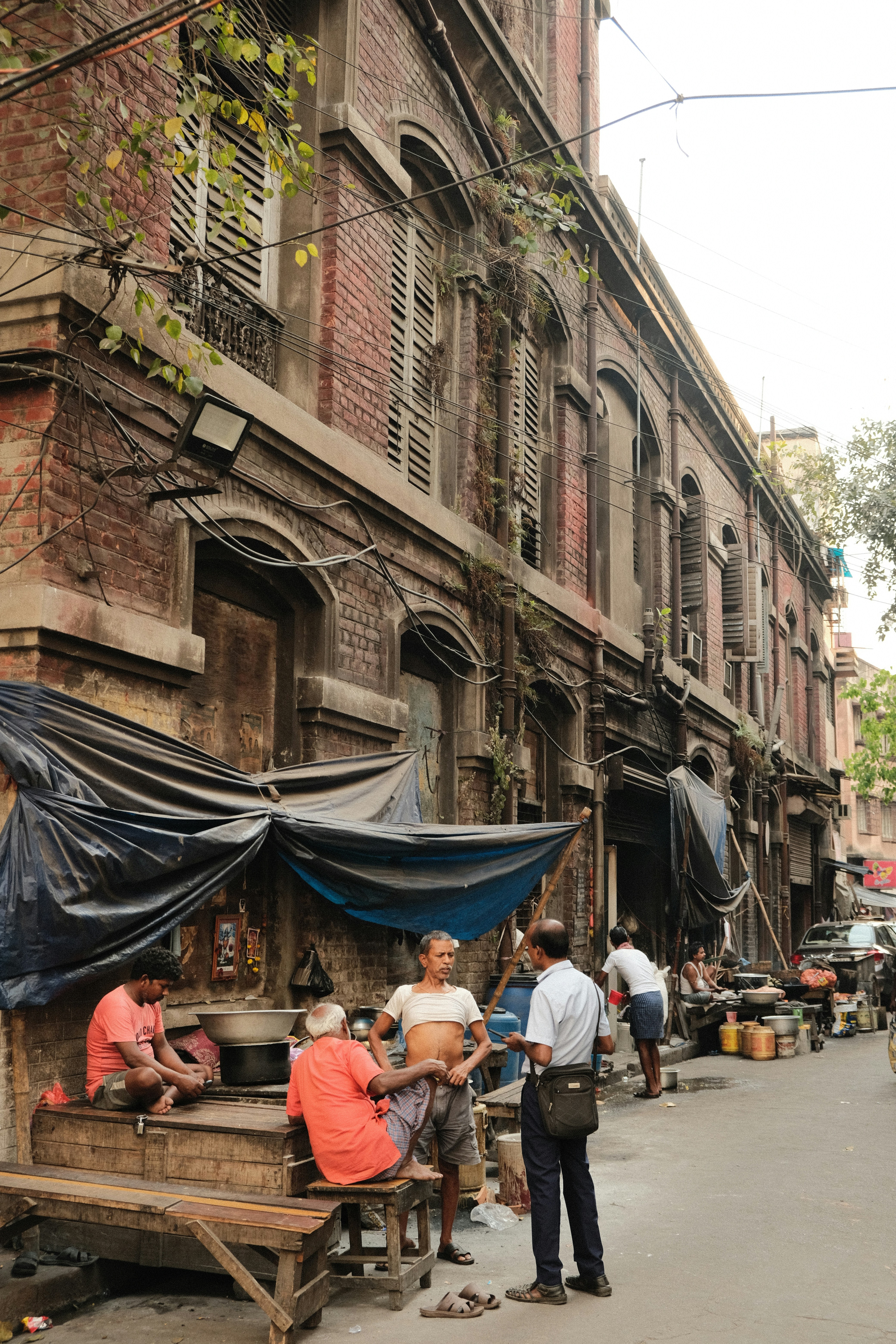 Brick-Lined Confluence: Conversations Under the Tarps