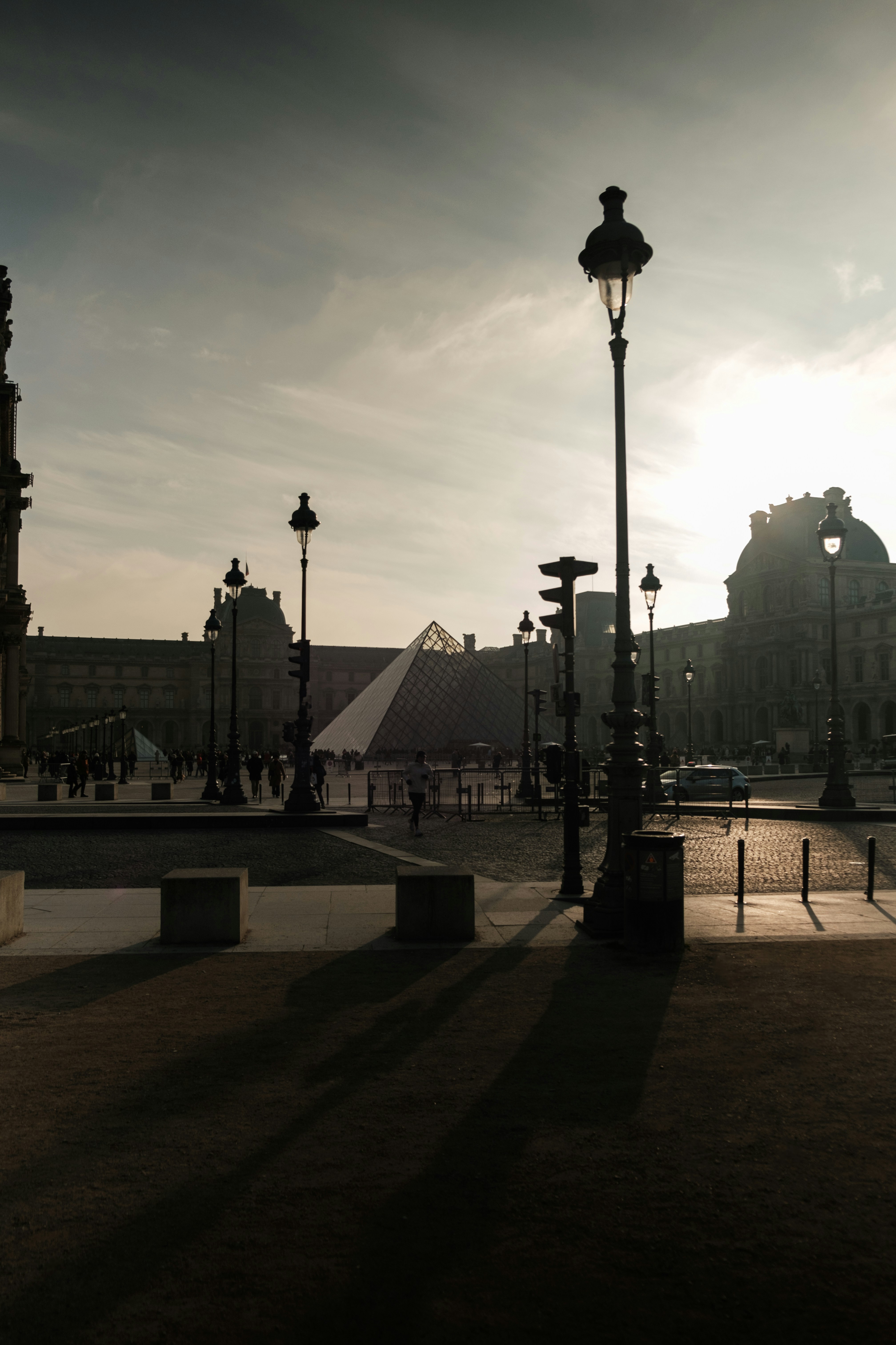 Grand Courtyard at Dusk: The Pyramid and Lampposts