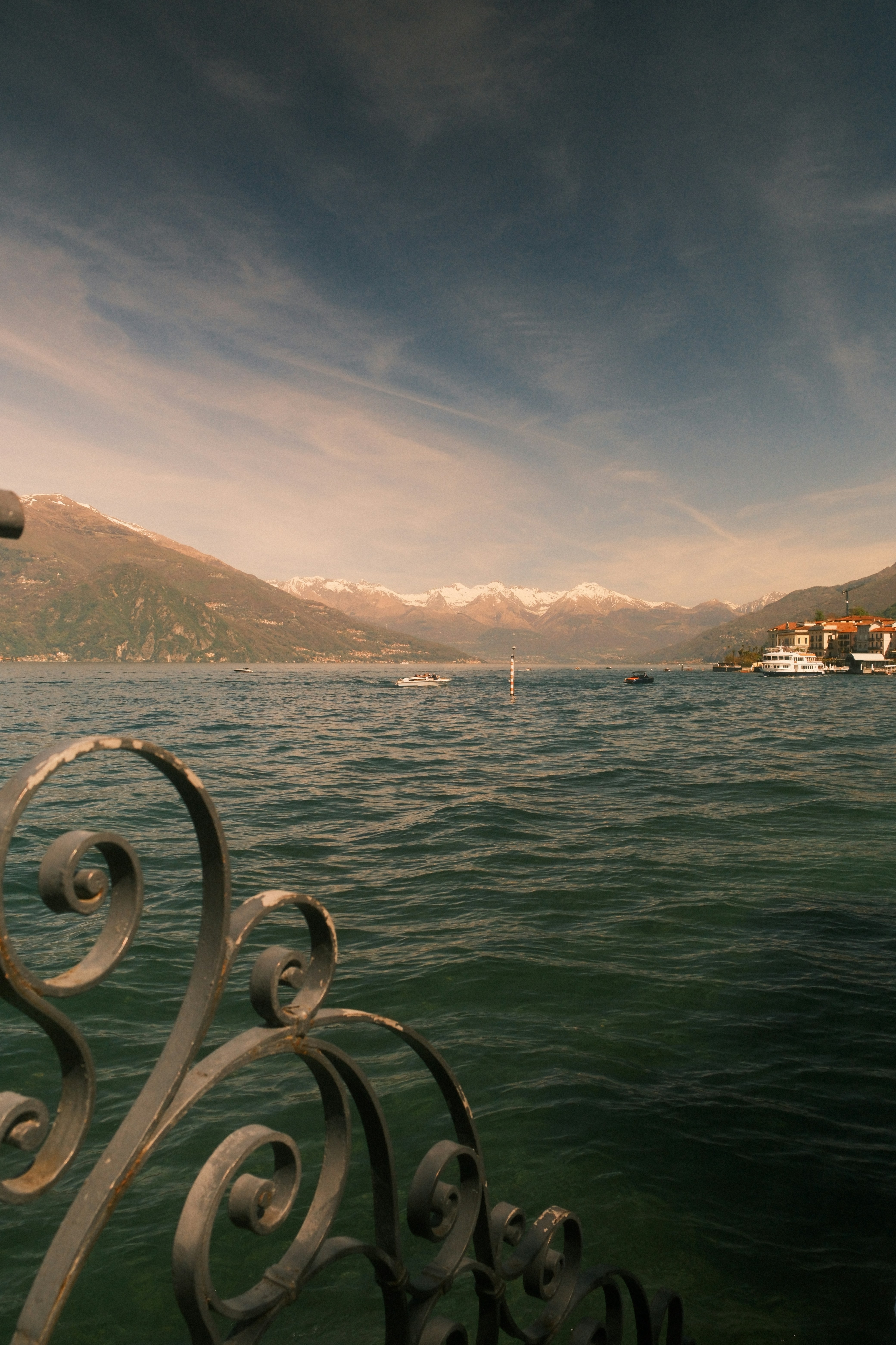 Iron Ribbons Over a Quiet Alpine Lake