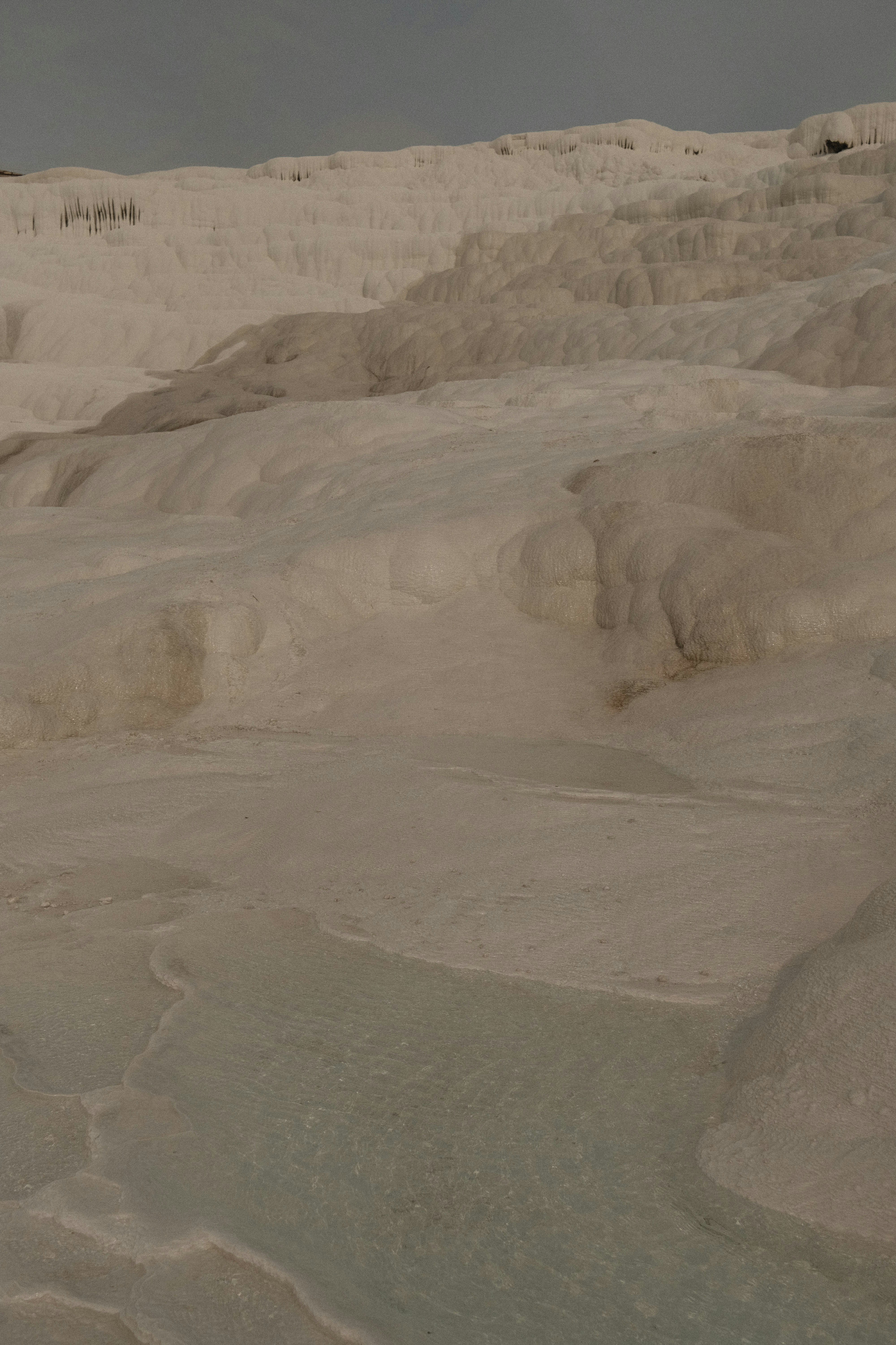 Alabaster Terraces and Quiet Pools under Pale Light