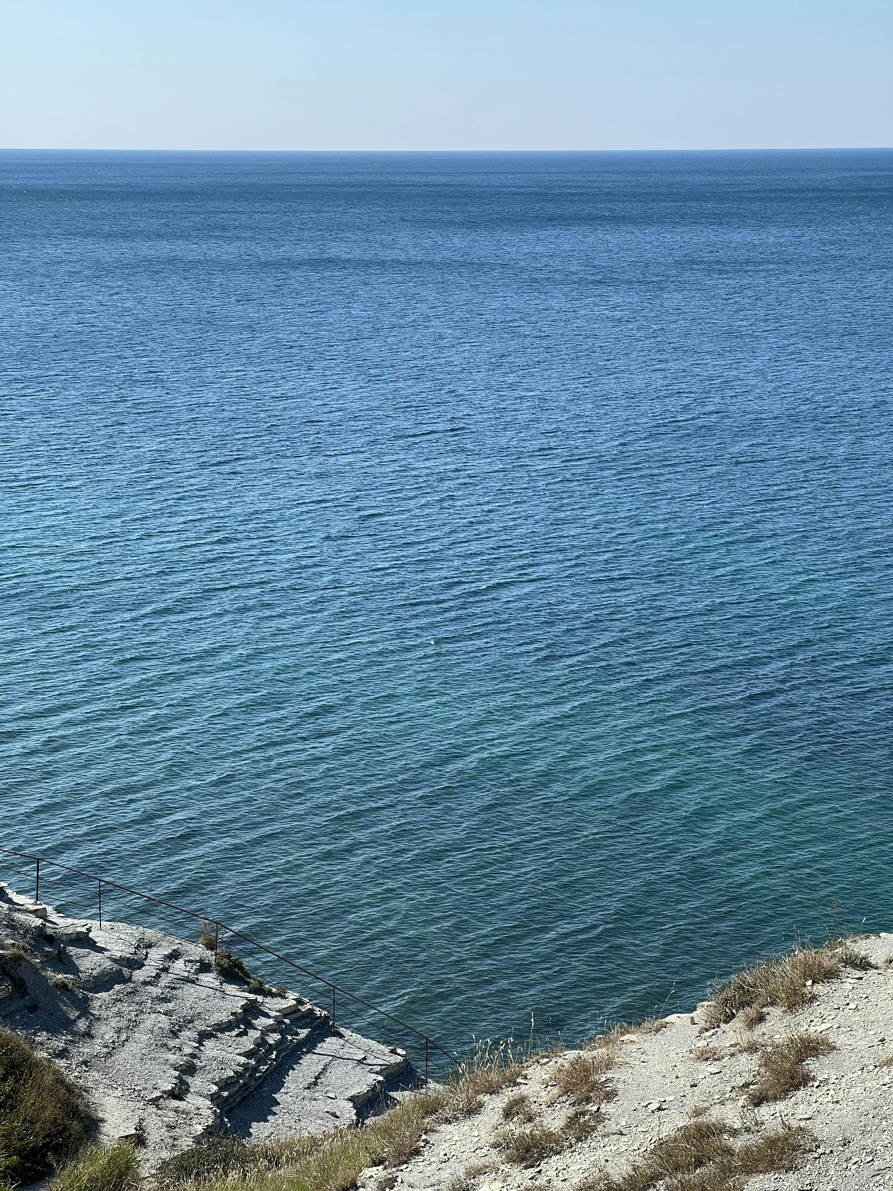 Coastal Cliffline Meeting a Quiet Ocean