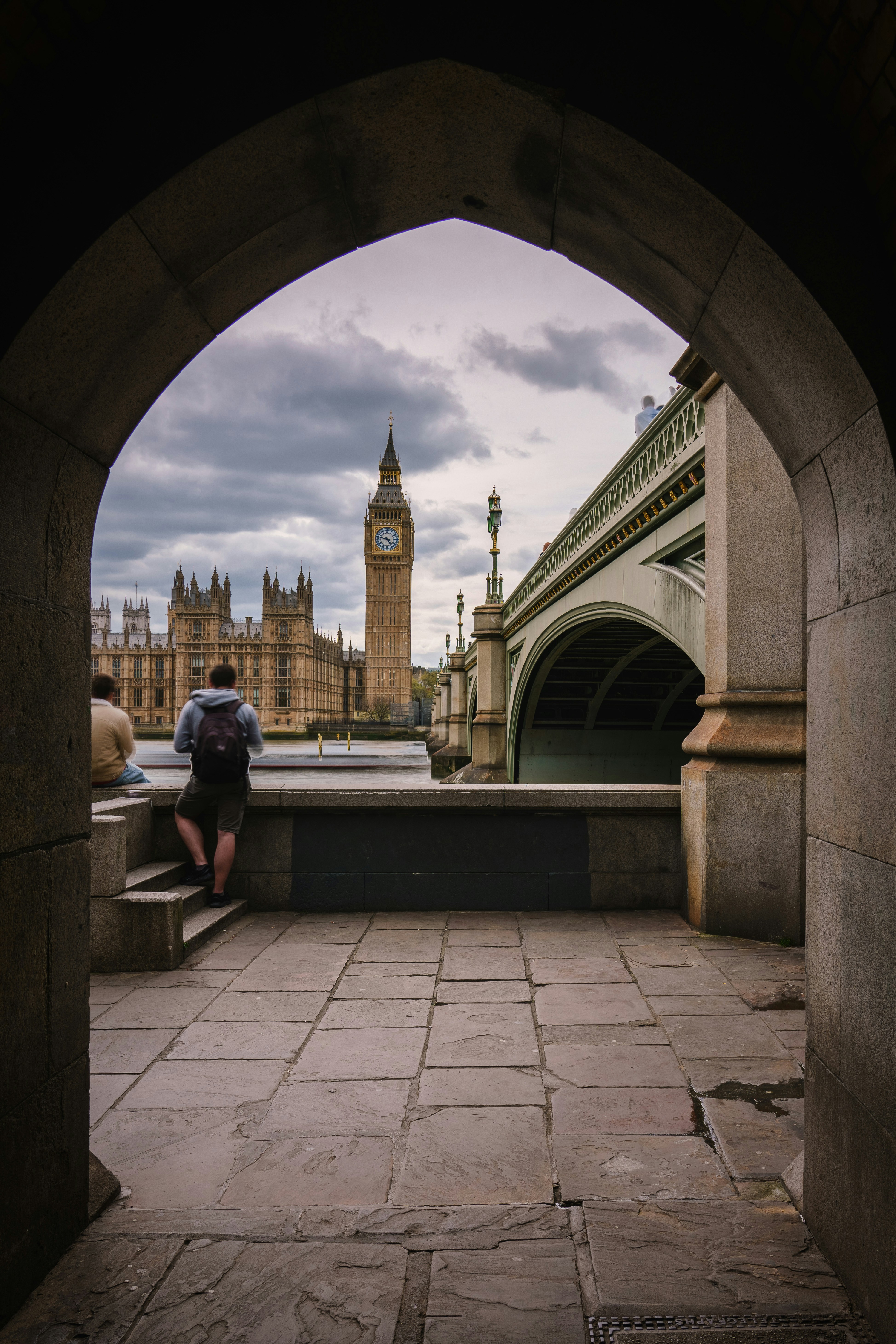 Archway to Westminster: Big Ben Framed by Stone and Thames