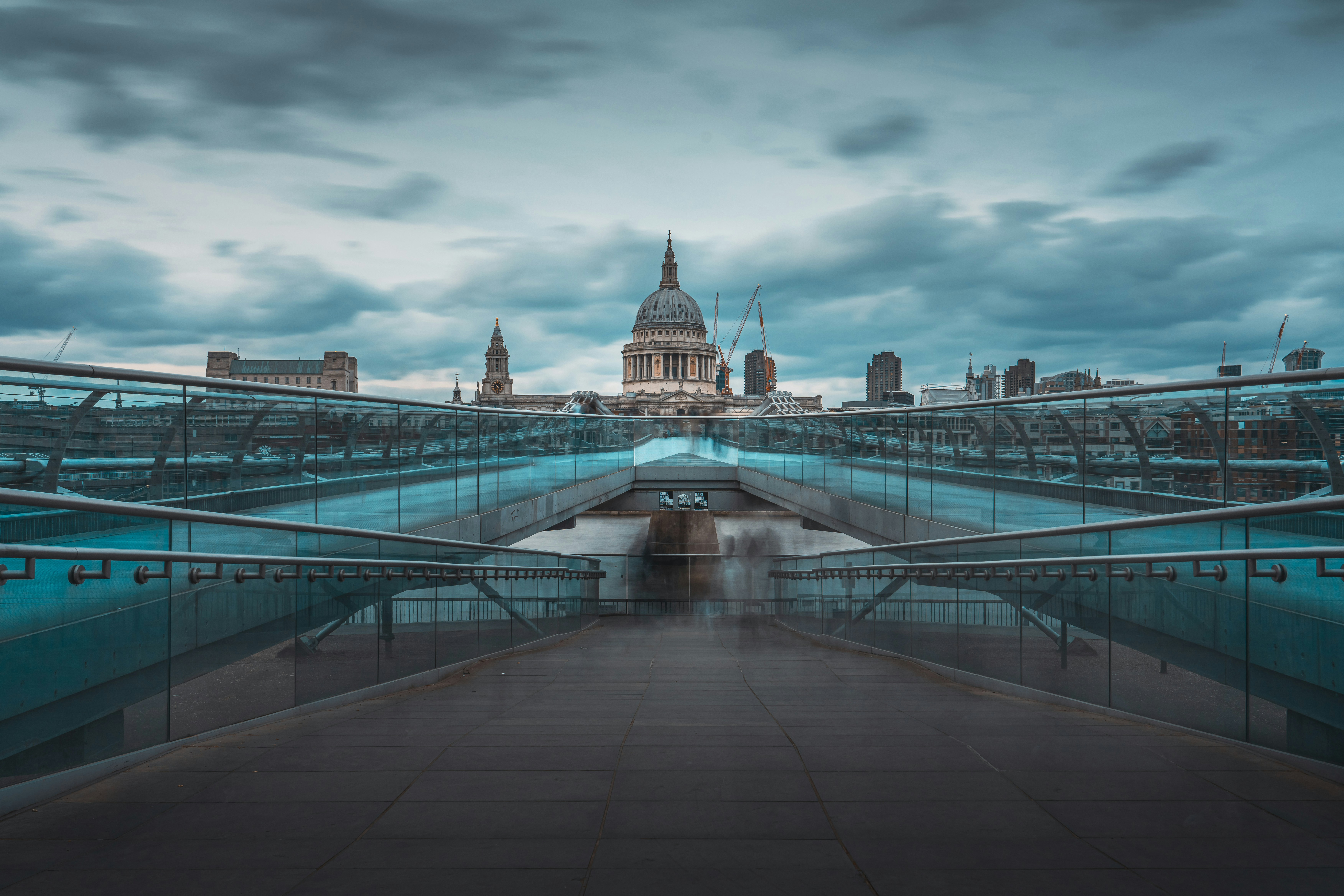 A view of a bridge with a building in the background photo – Free ...