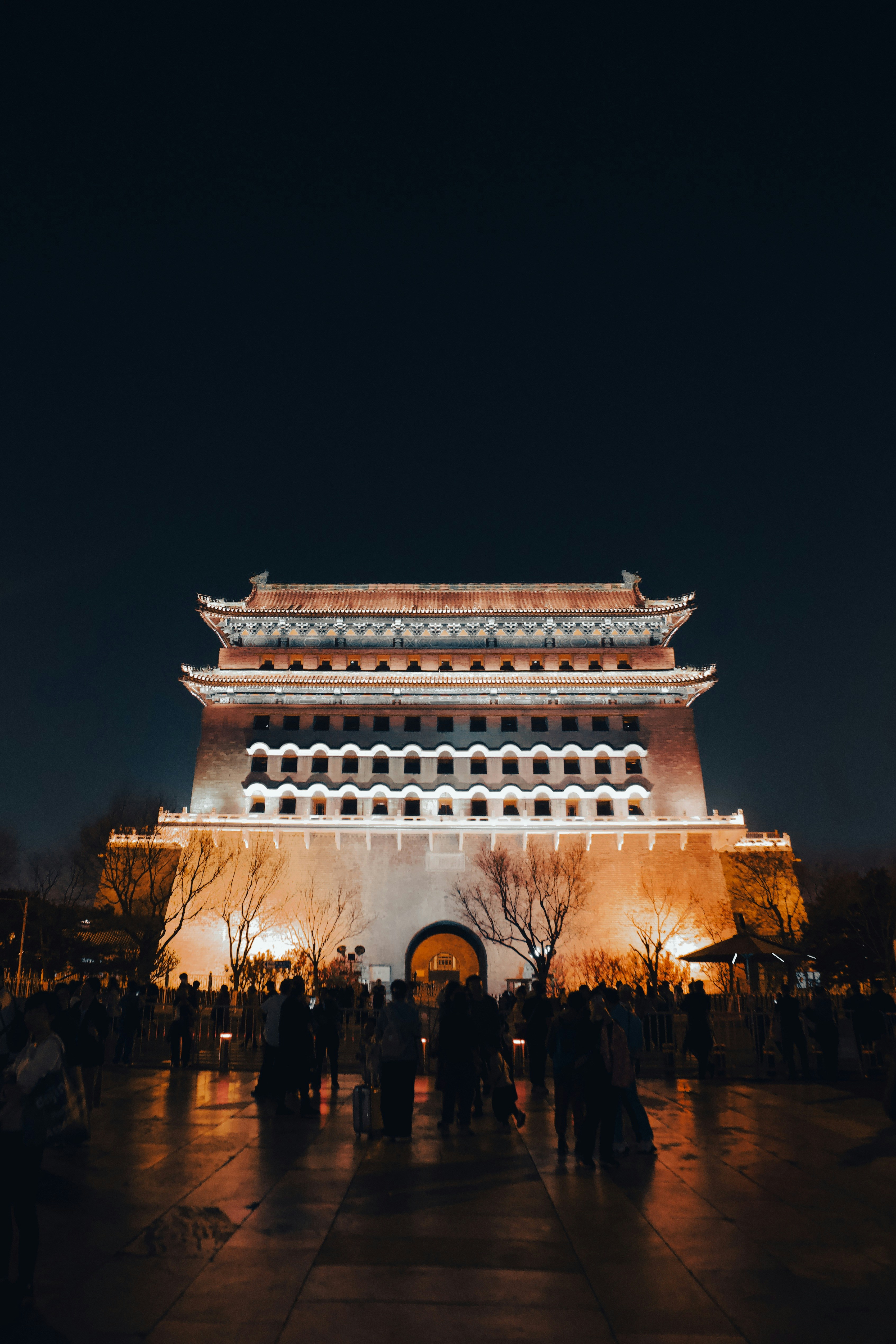 Lantern-lit Multi-Tier Gate at Midnight, Framed by Quiet Crowds