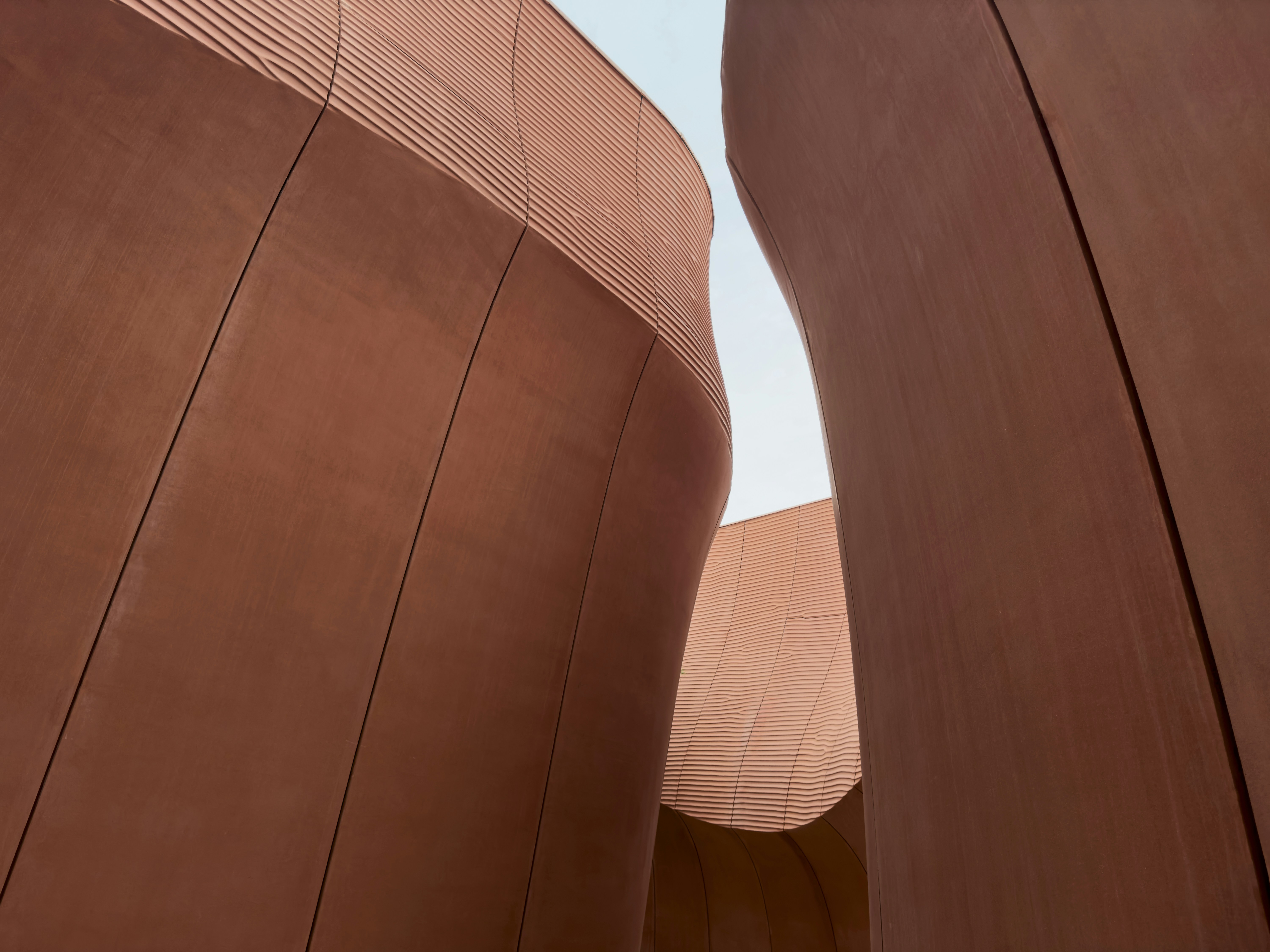 A couple of tall brown buildings next to each other photo – Free Uae ...
