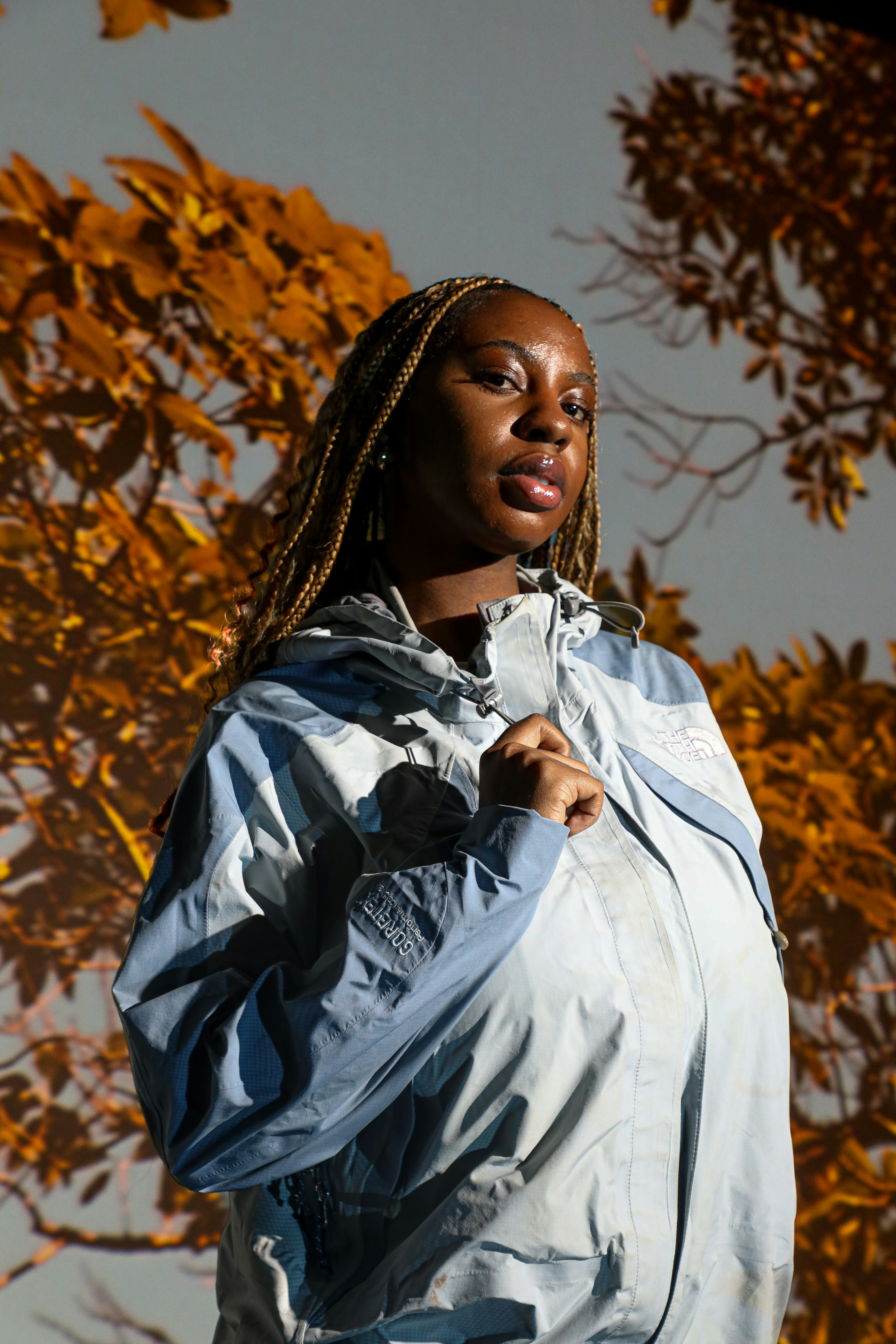 A woman with dreadlocks standing in front of a tree photo – Free ...