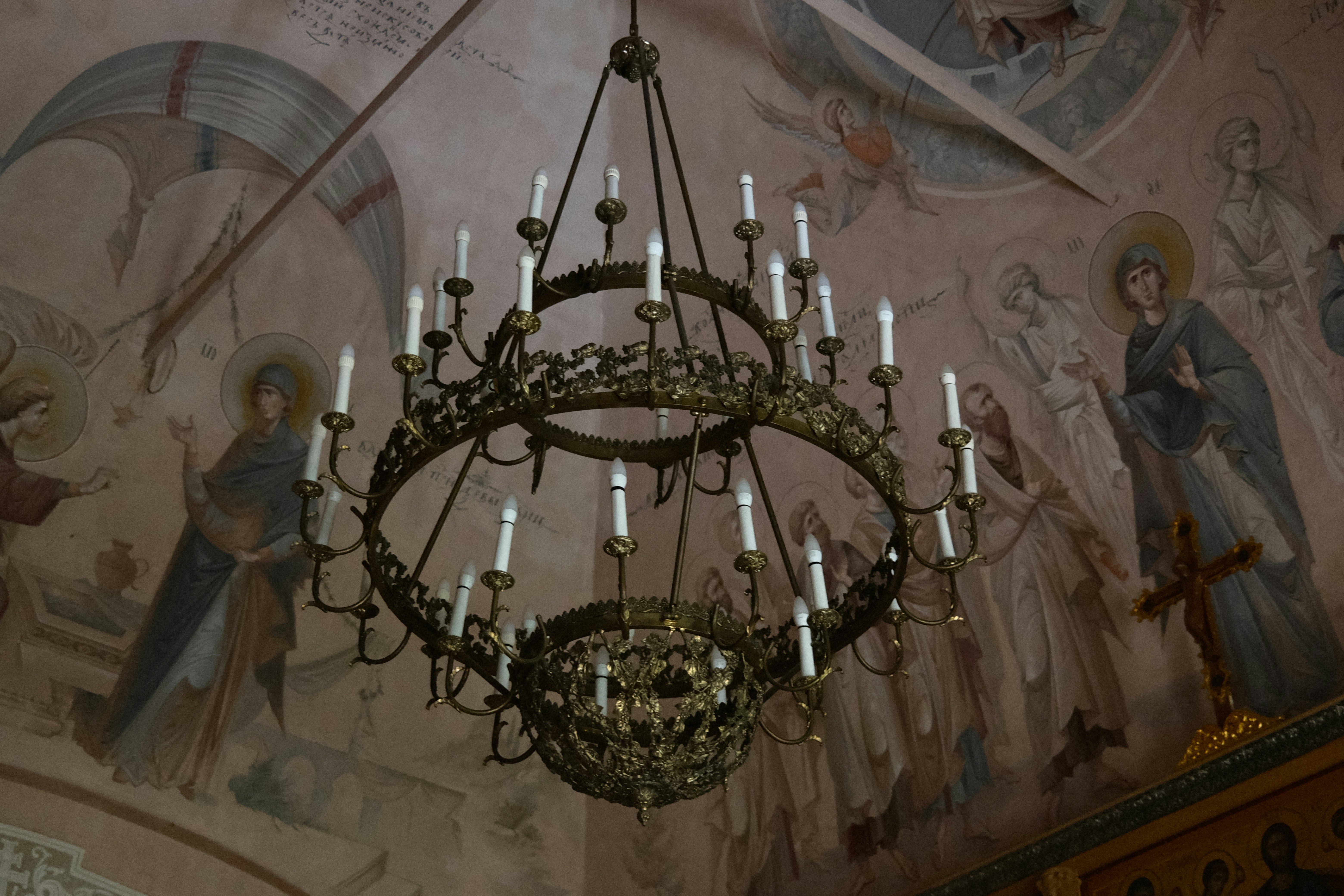 Chandelier Crowned by Frescoed Vaults: A Quiet Cathedral Moment