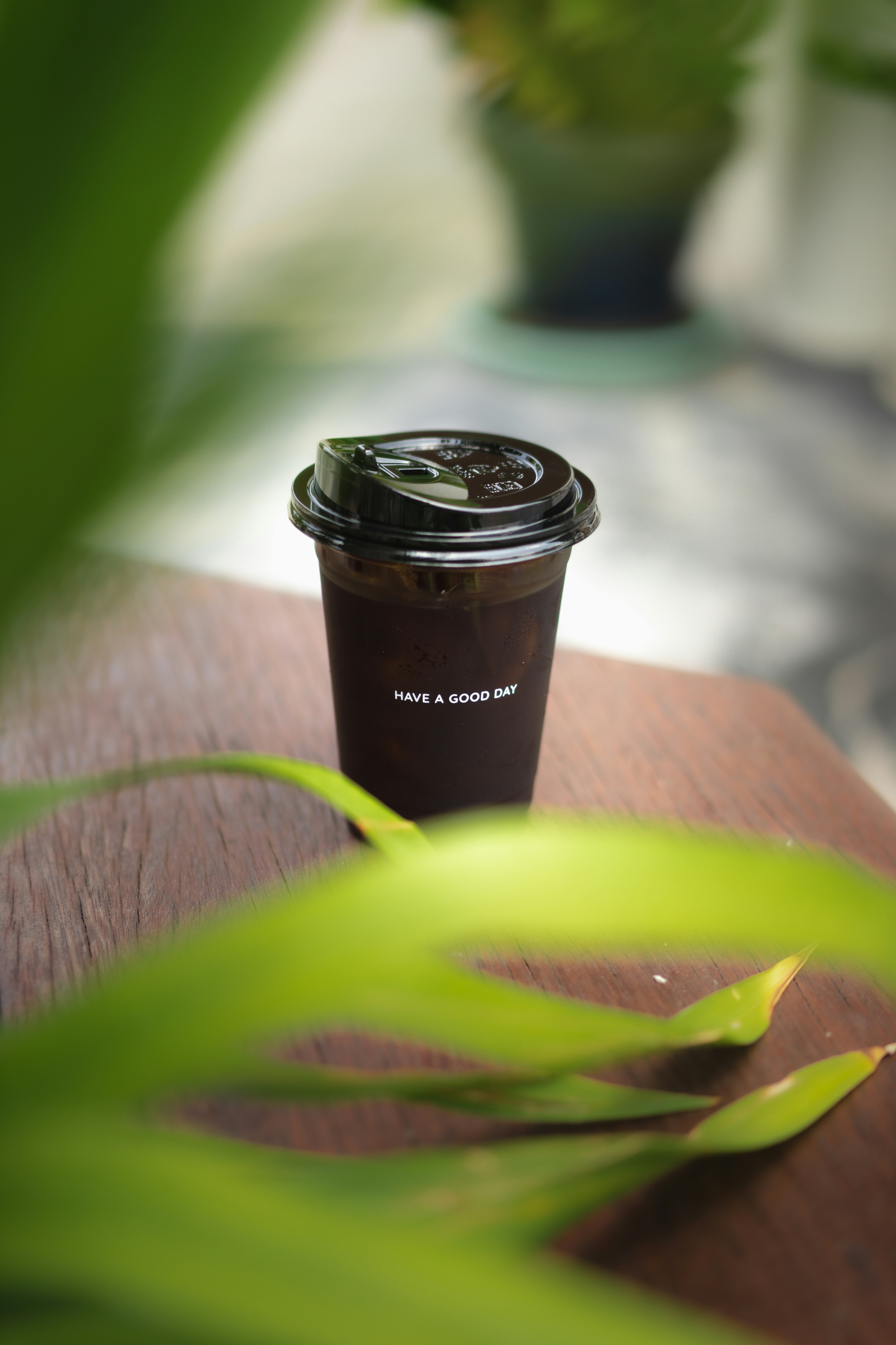 A cup of coffee sitting on top of a wooden table photo – Free Coffee ...