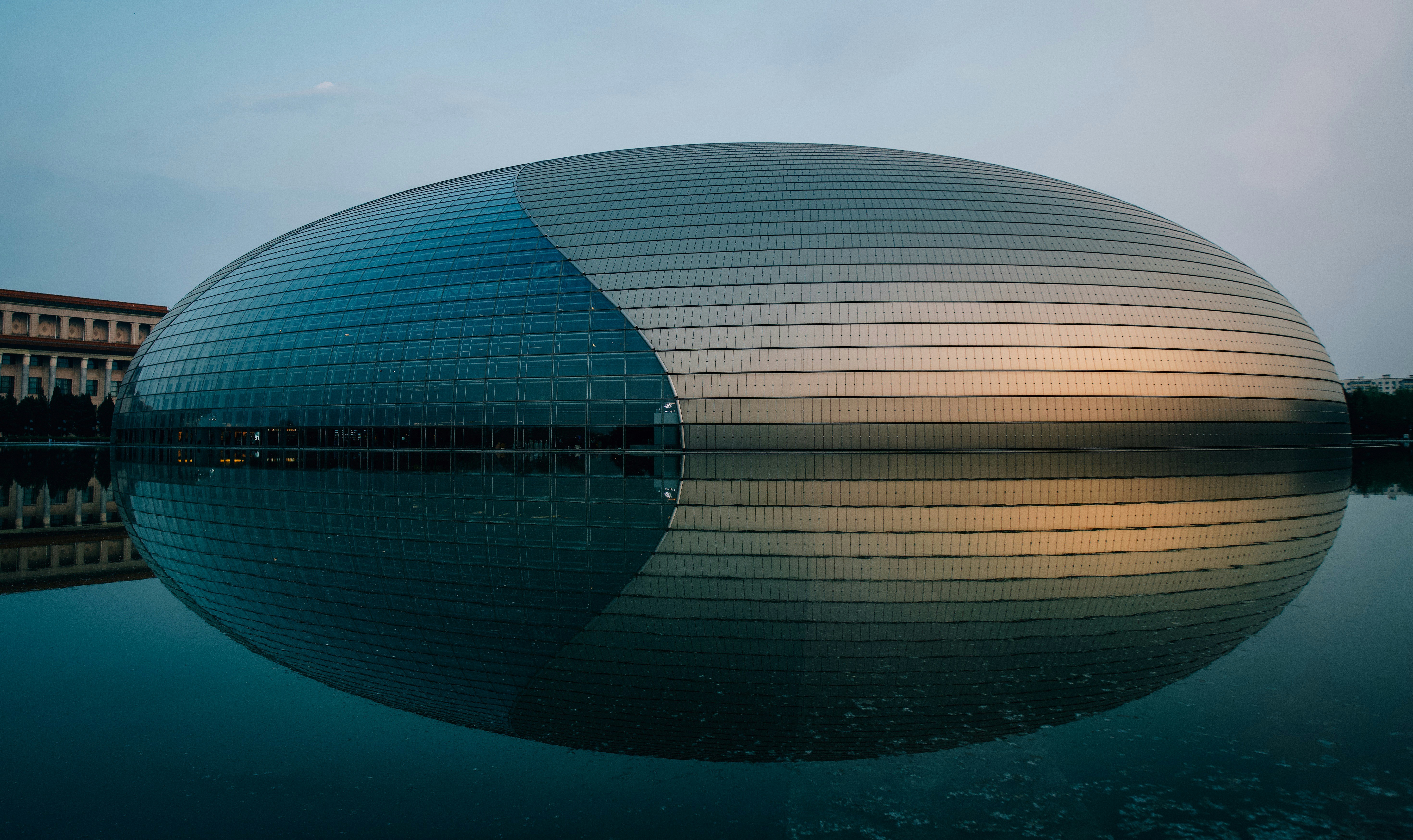 Stunning architecture at National Centre for the Performing Arts in Beijing, Peking, China during upcoming blue hour