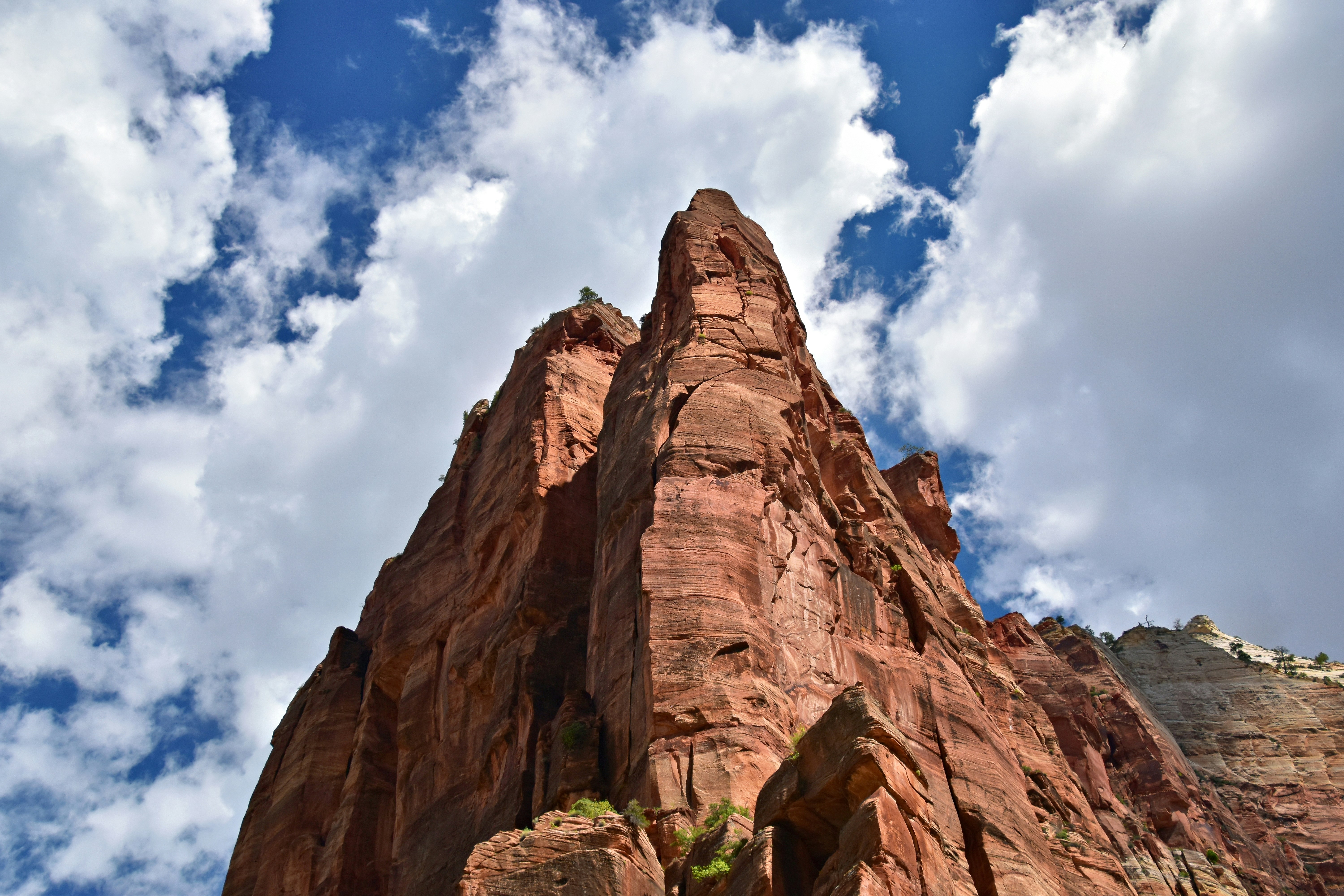 A very tall rock formation with a sky background photo – Free Zion ...