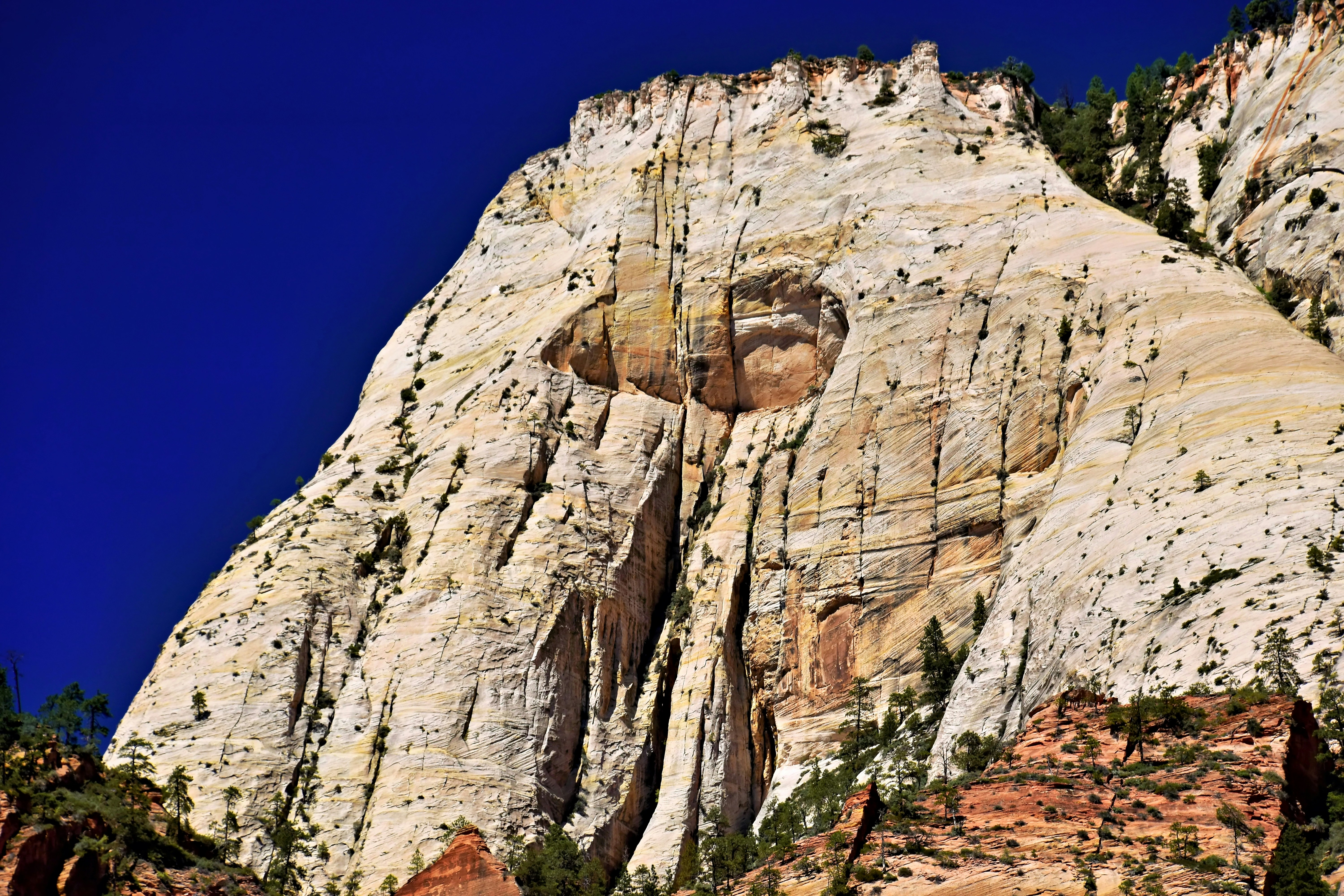 A mountain with a face carved into the side of it photo – Free Scenery ...