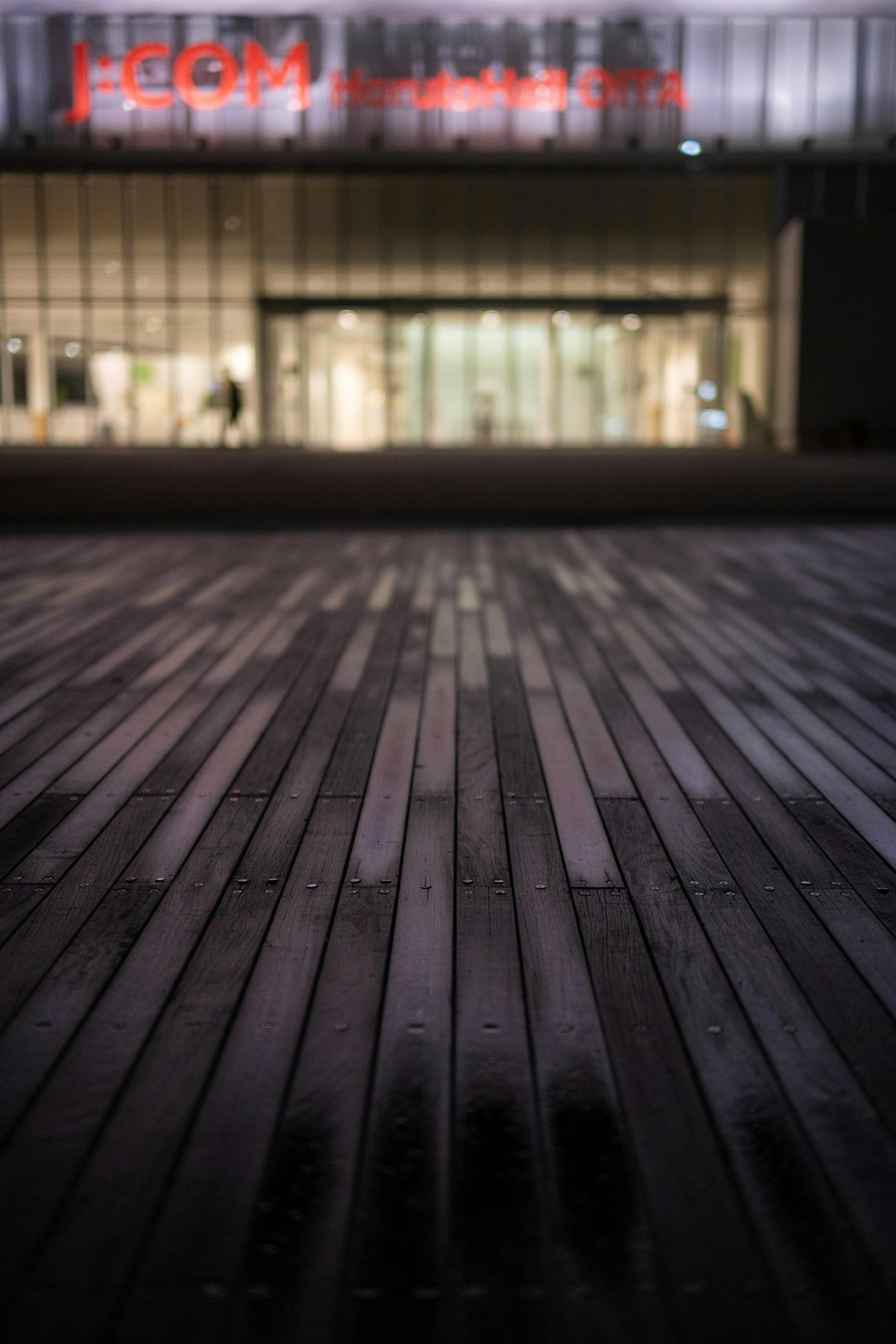 A wooden floor with a building in the background photo – Free Grey ...