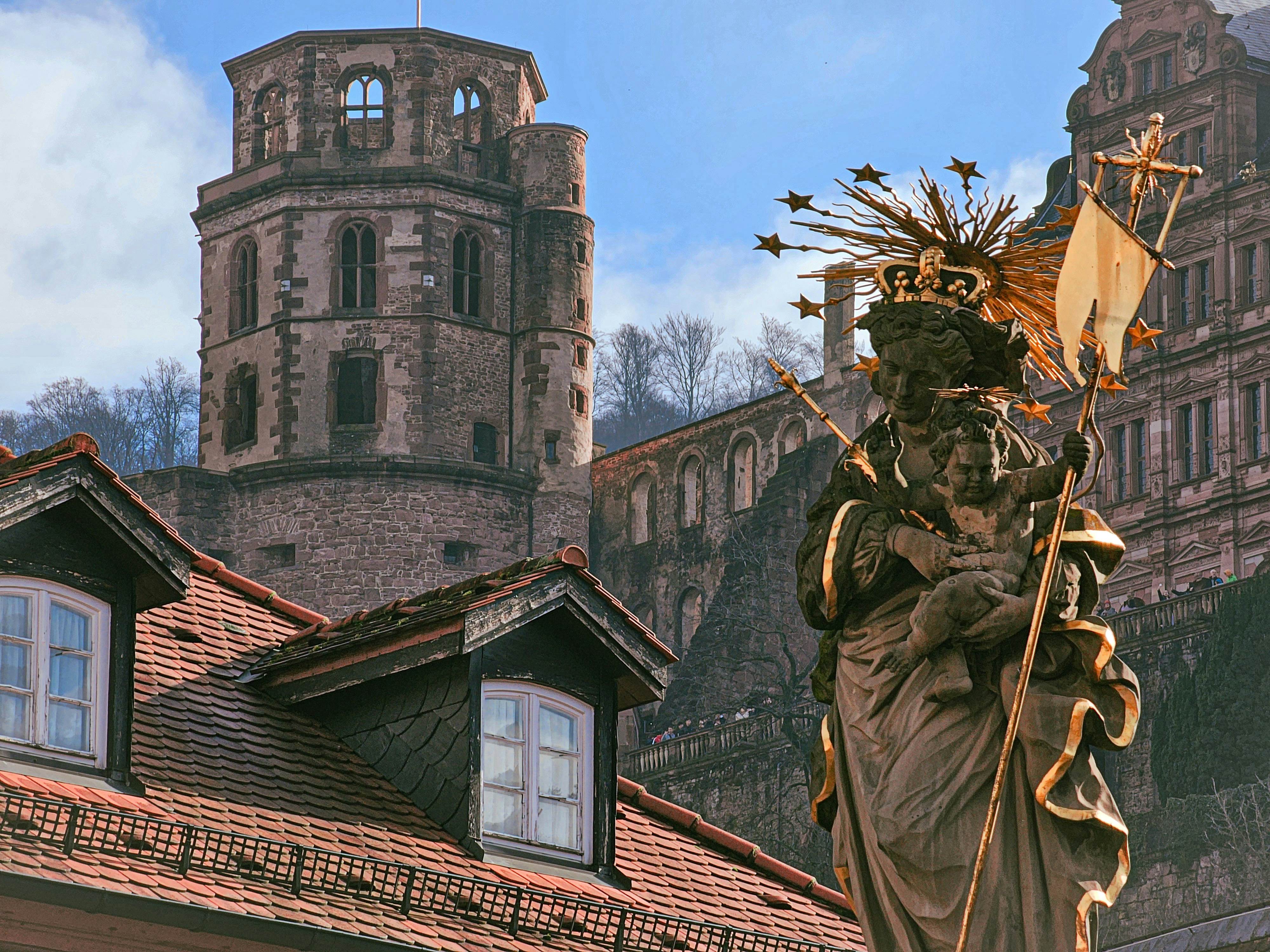 The Crowned Sentinel Over the Rooftops of a Medieval Fortress