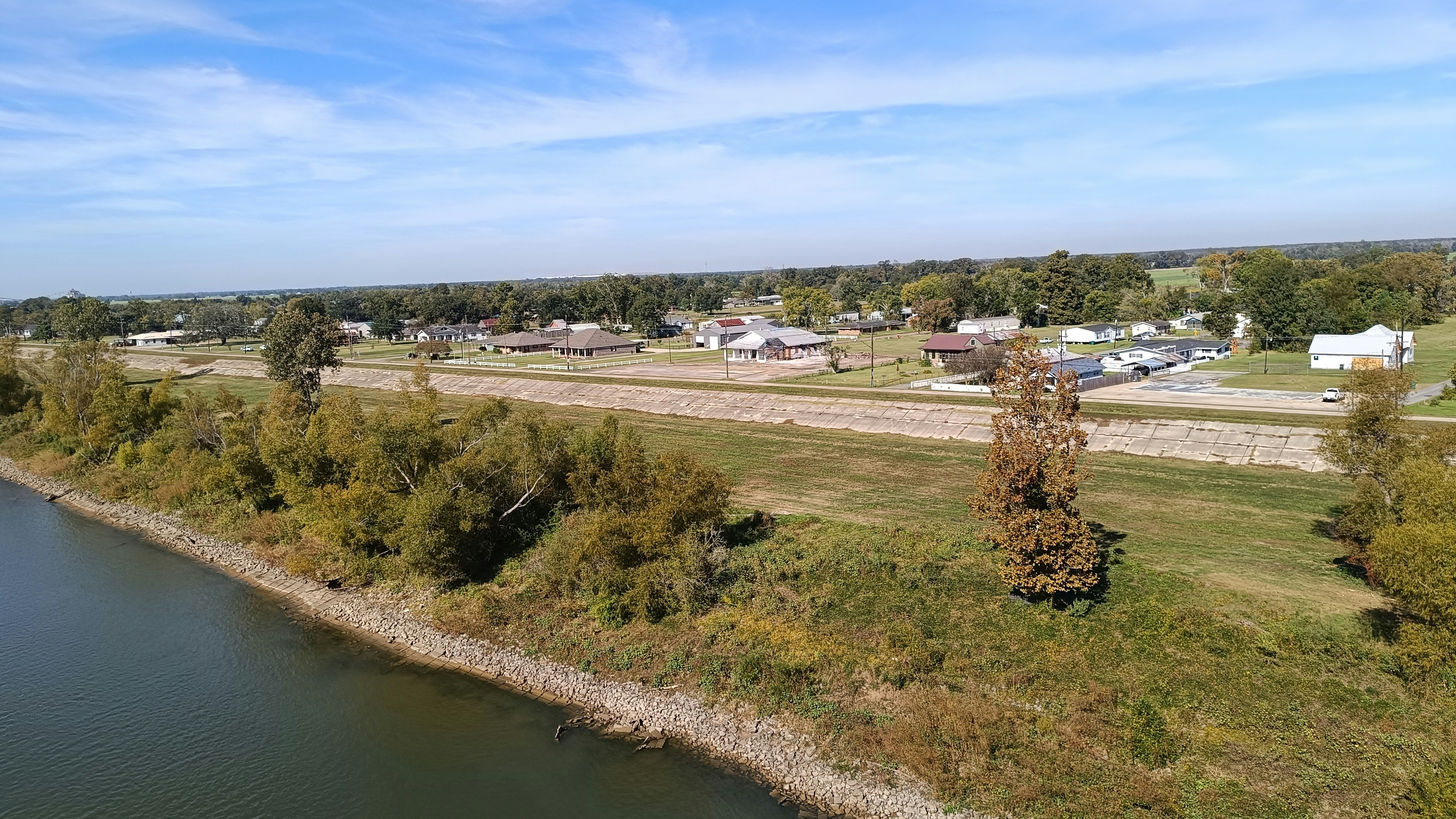 Riverside Junction: Quiet Village Framed by Fields and Water