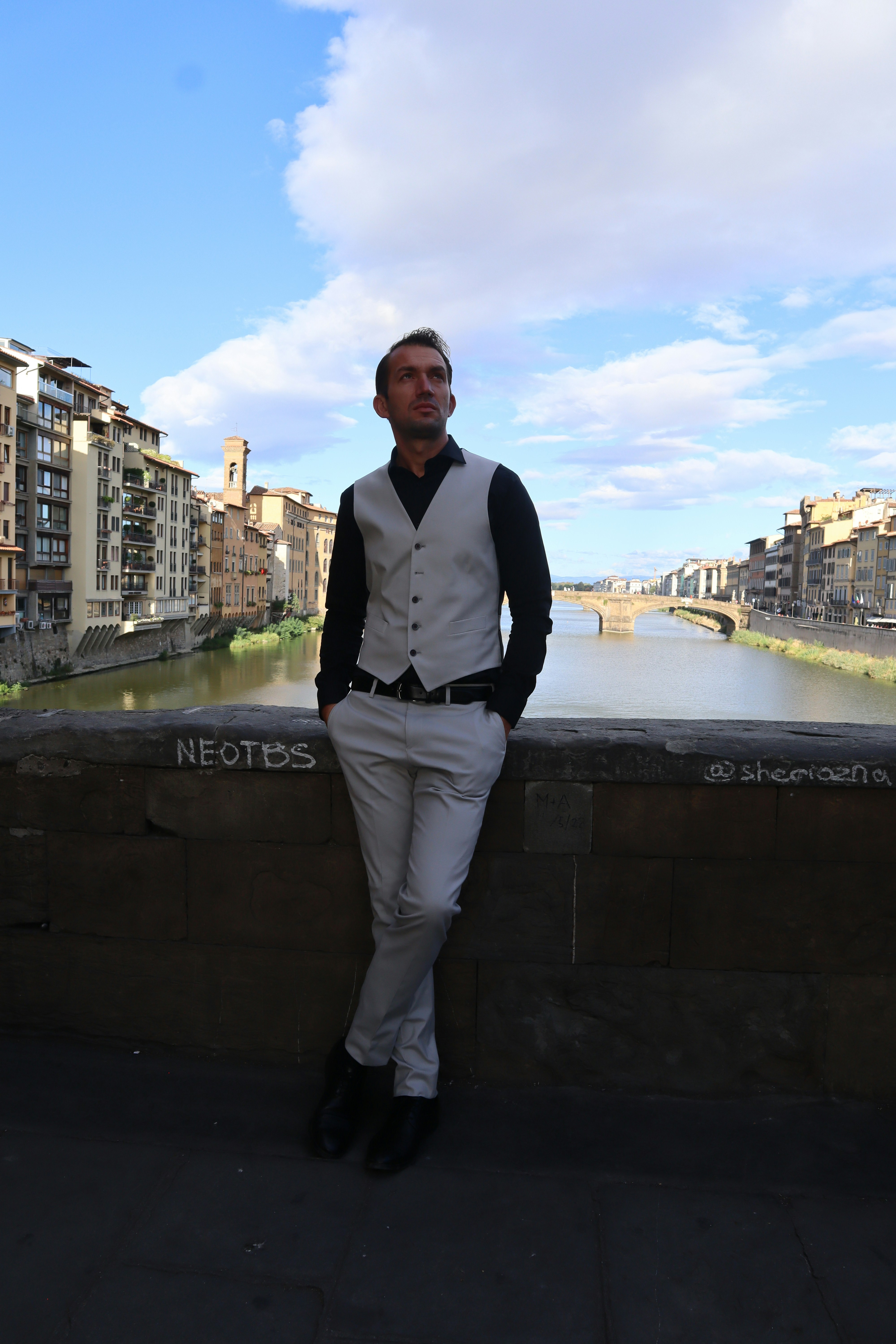 Dapper Stillness on the Arno: Portrait Along Florence's Riverfront