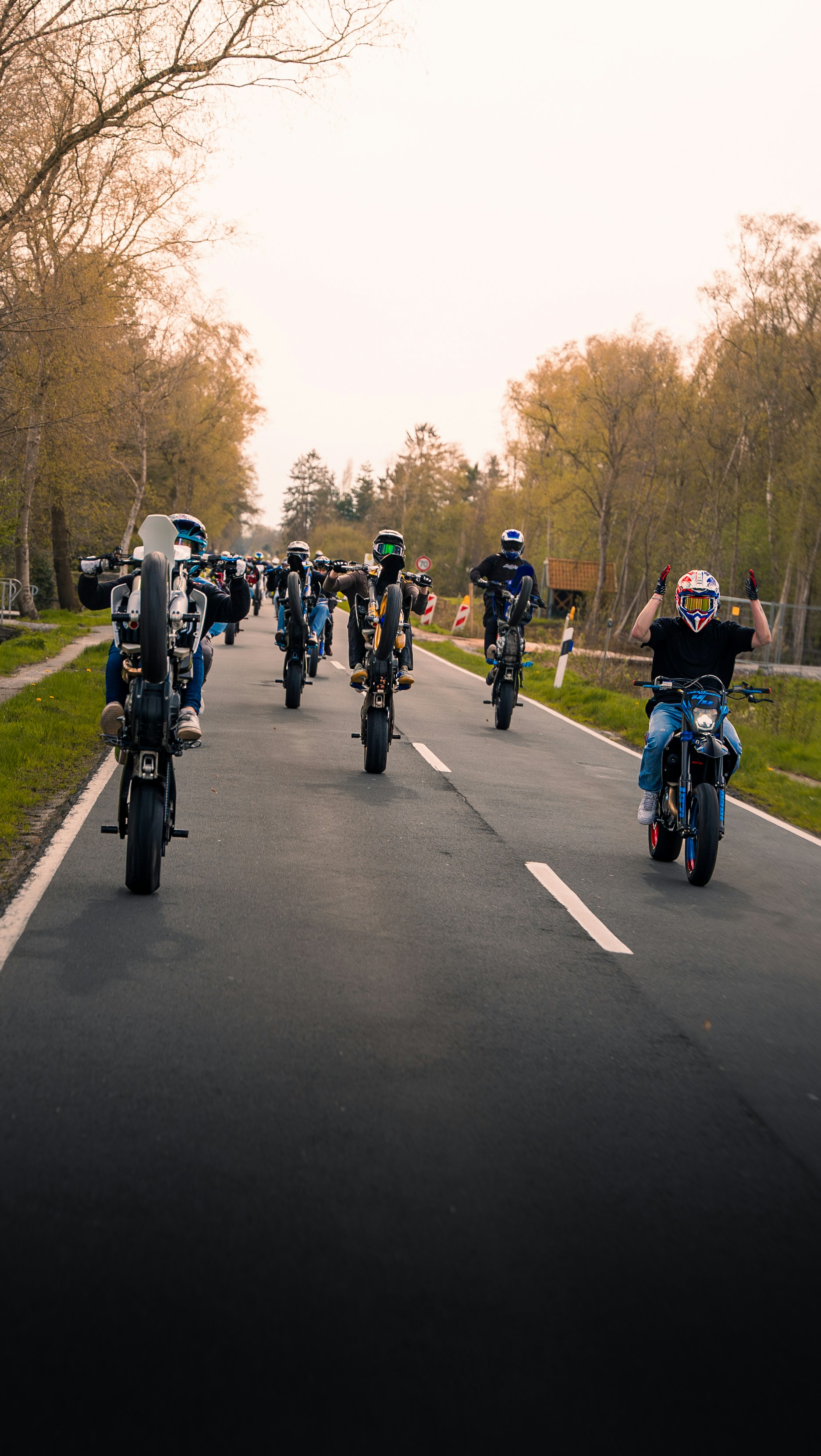 A group of people riding motorcycles down a road photo – Free Oldenburg ...