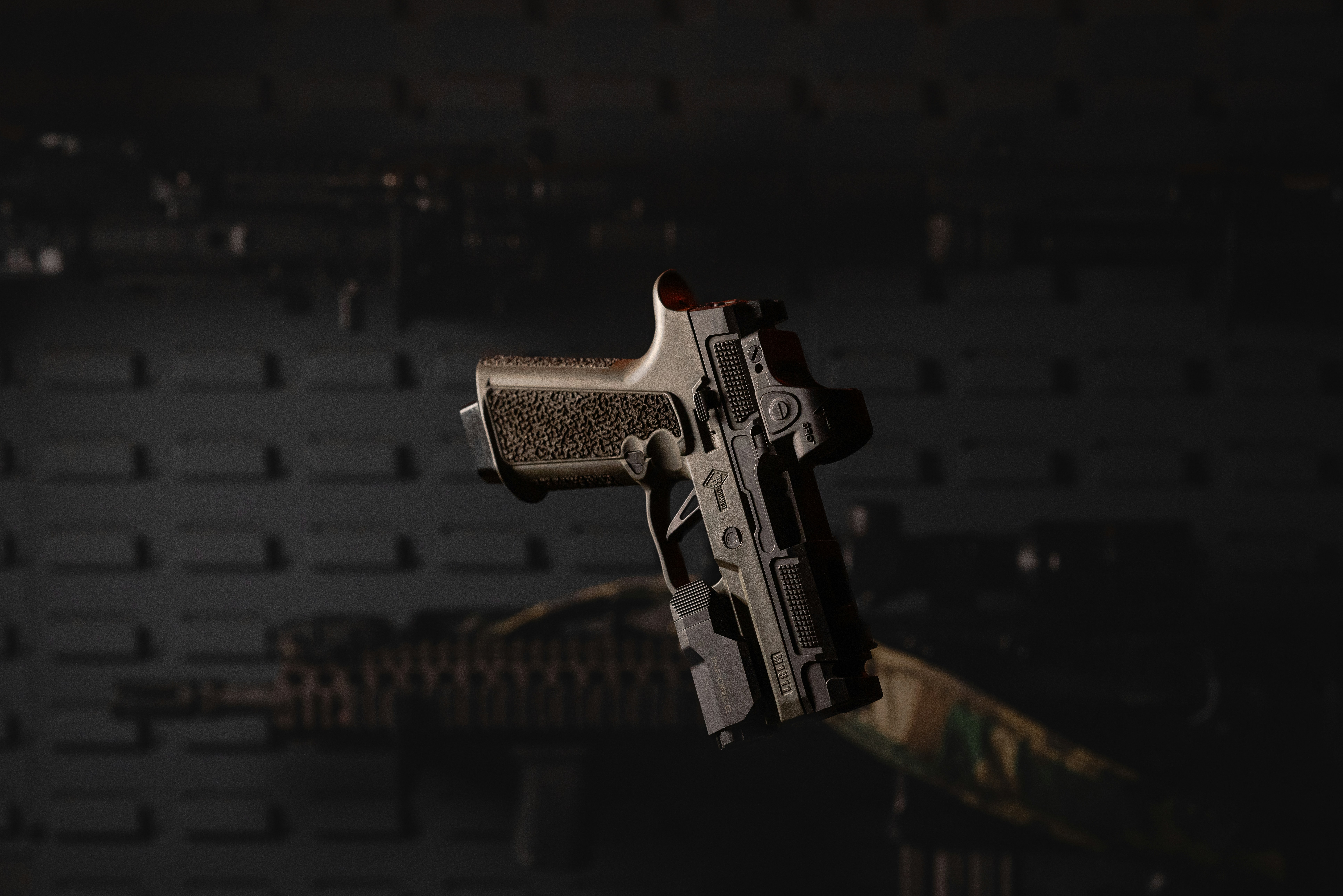 A meticulously detailed firearm suspended against a dark backdrop, showcasing its intricate design and craftsmanship.