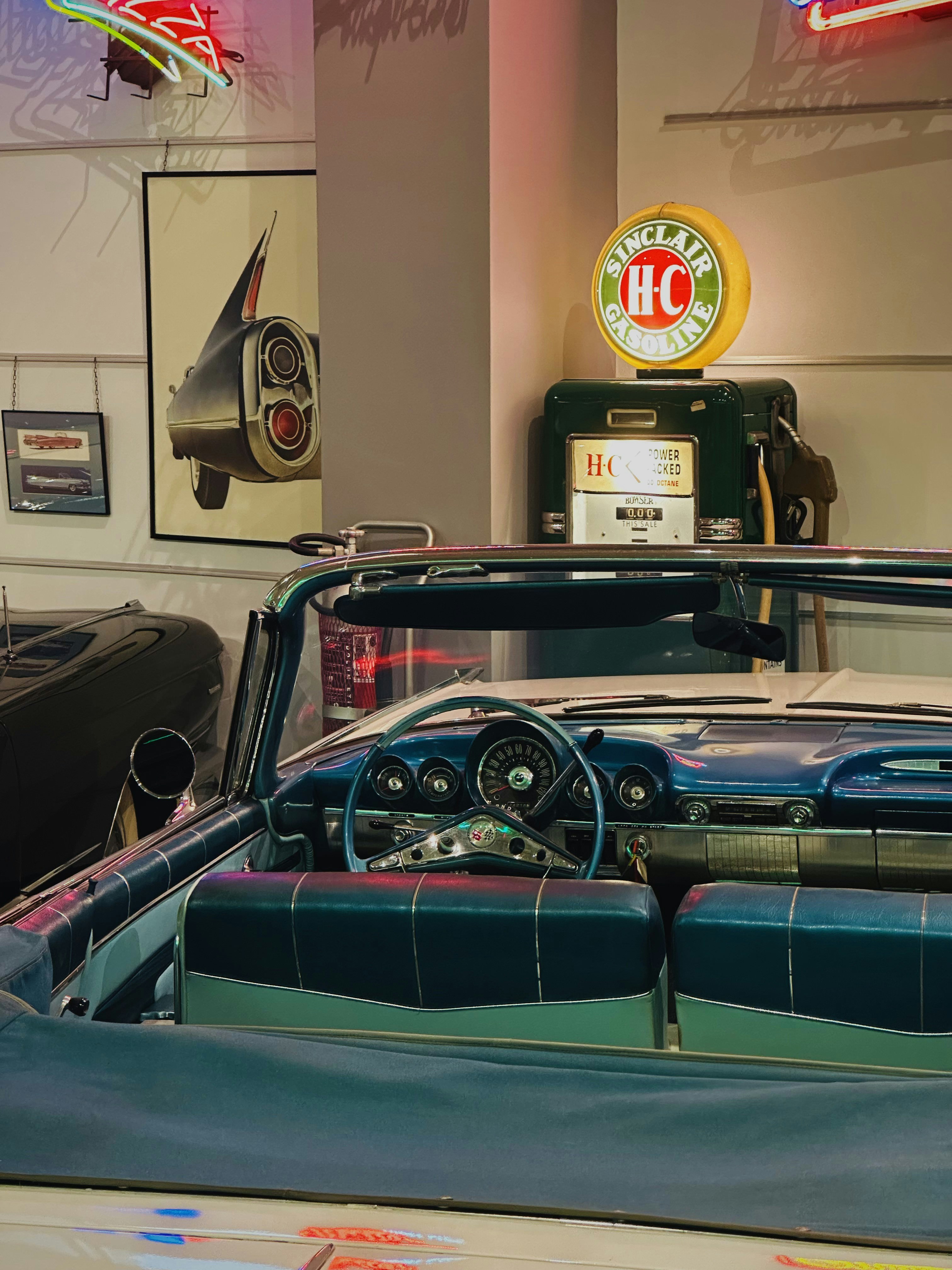 Neon-Lit Dash: A Vintage Convertible in a Retro Showroom