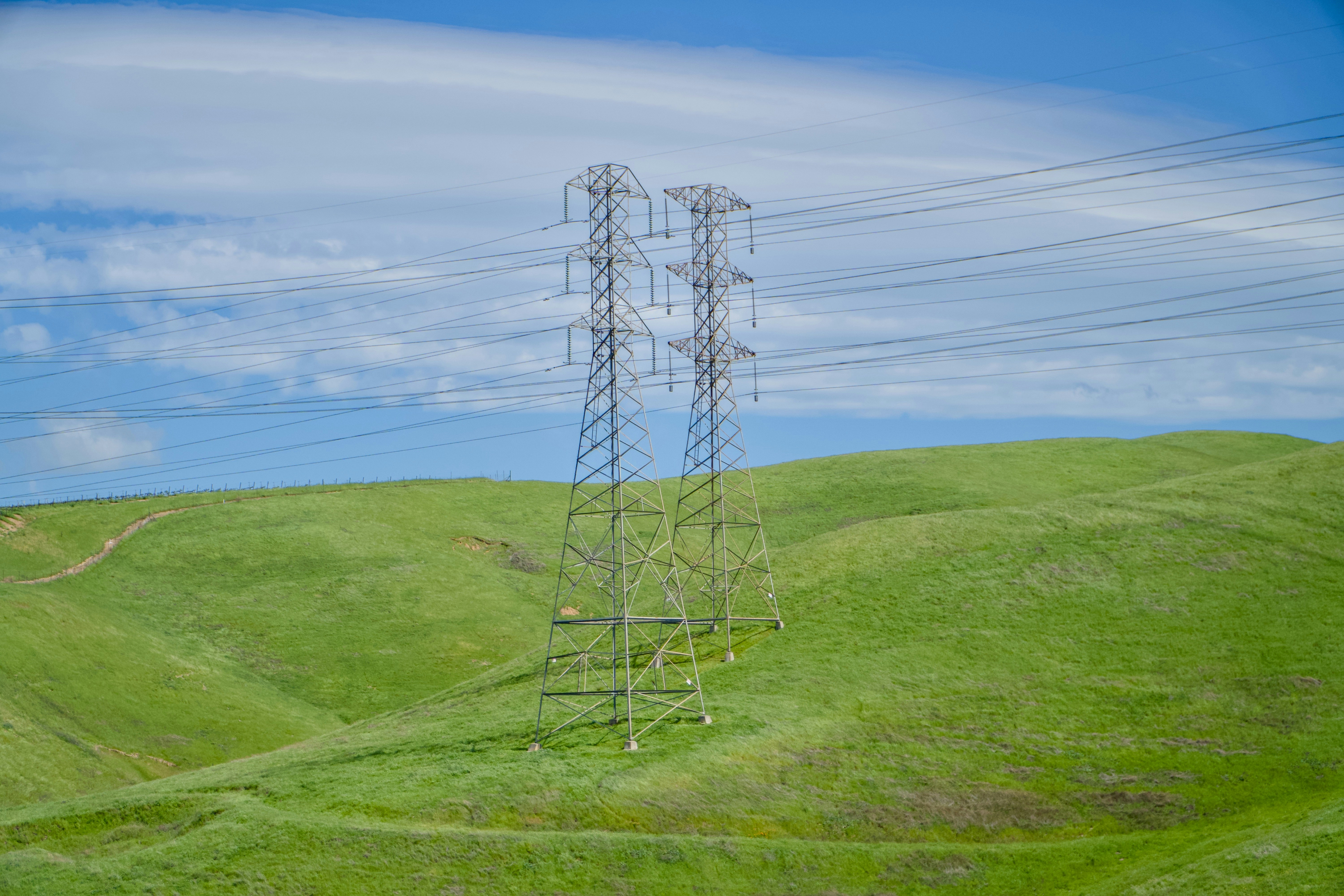 A high voltage power line on a green hillside photo – Free Livermore ...