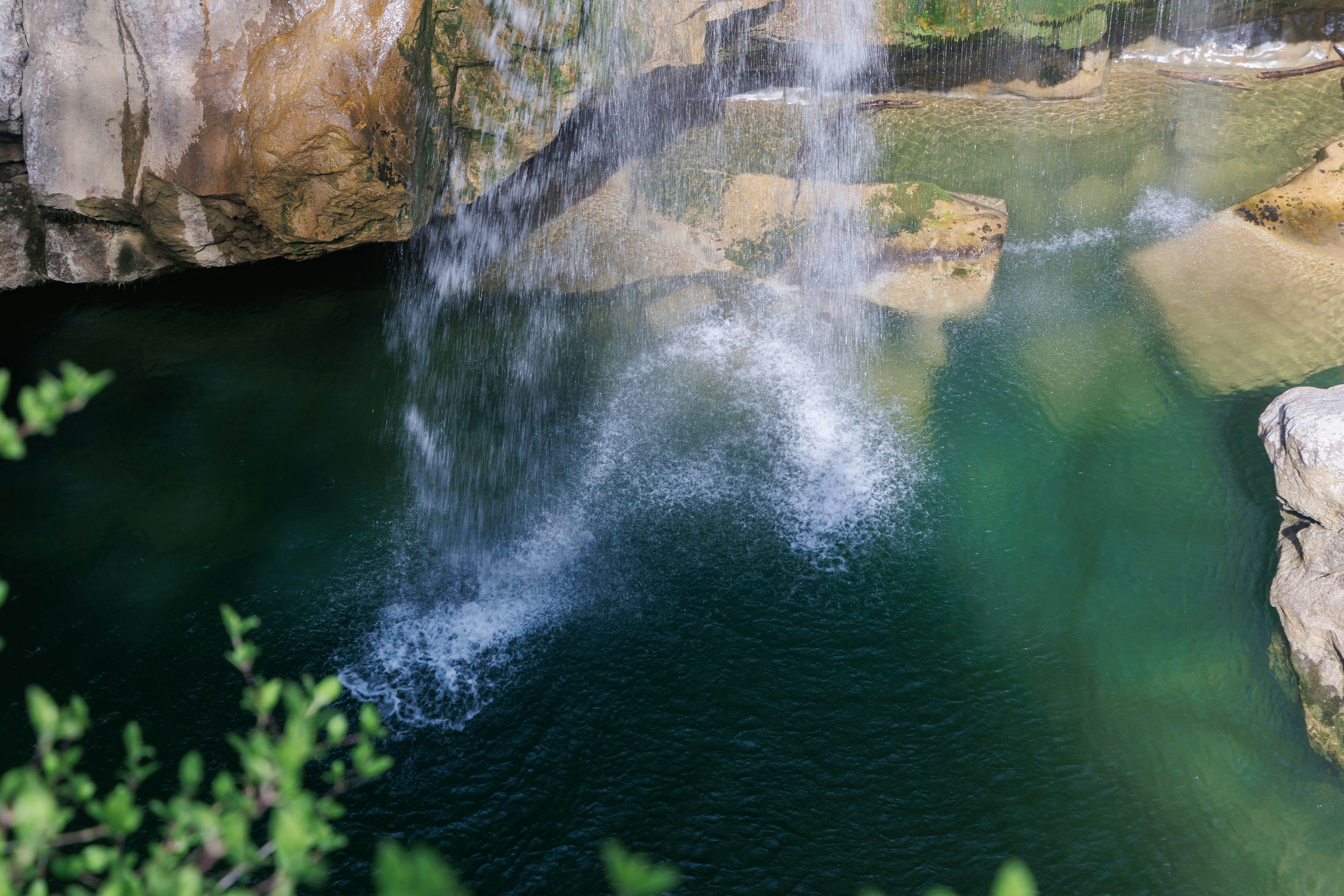 Ангурский водопад | a large waterfall is coming out of the water
