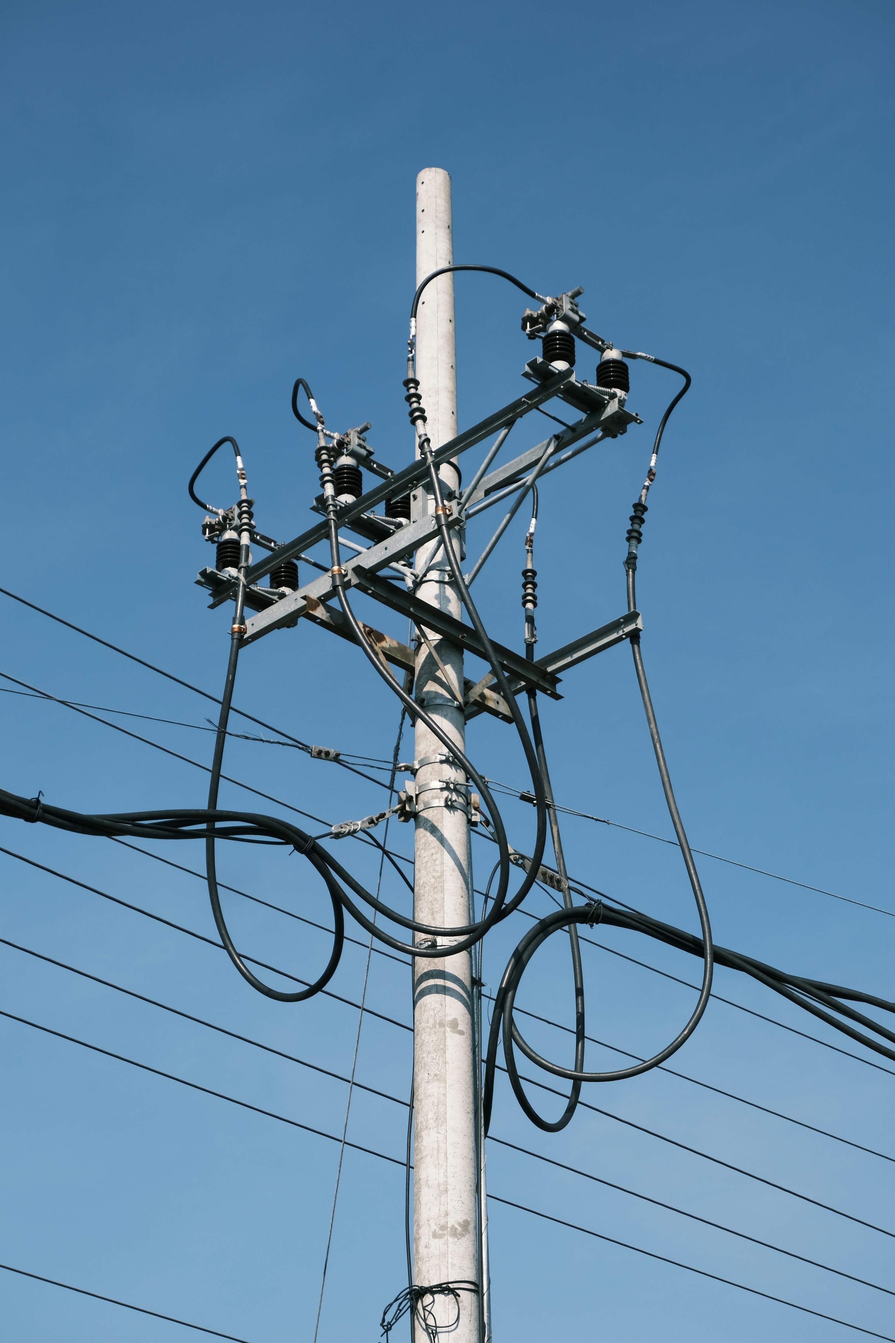 A telephone pole with multiple wires attached to it photo – Free ...