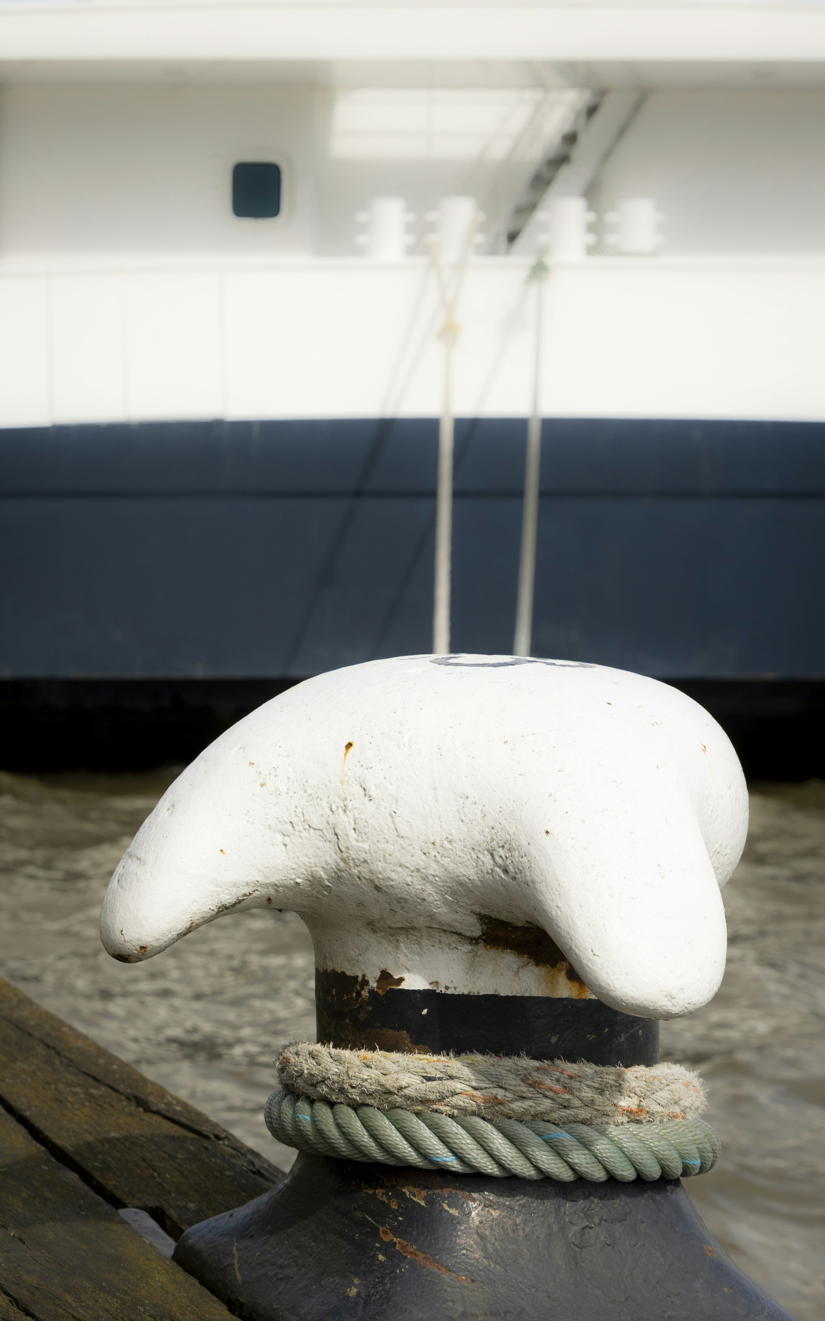 A large white object sitting on top of a wooden dock photo – Free Line ...