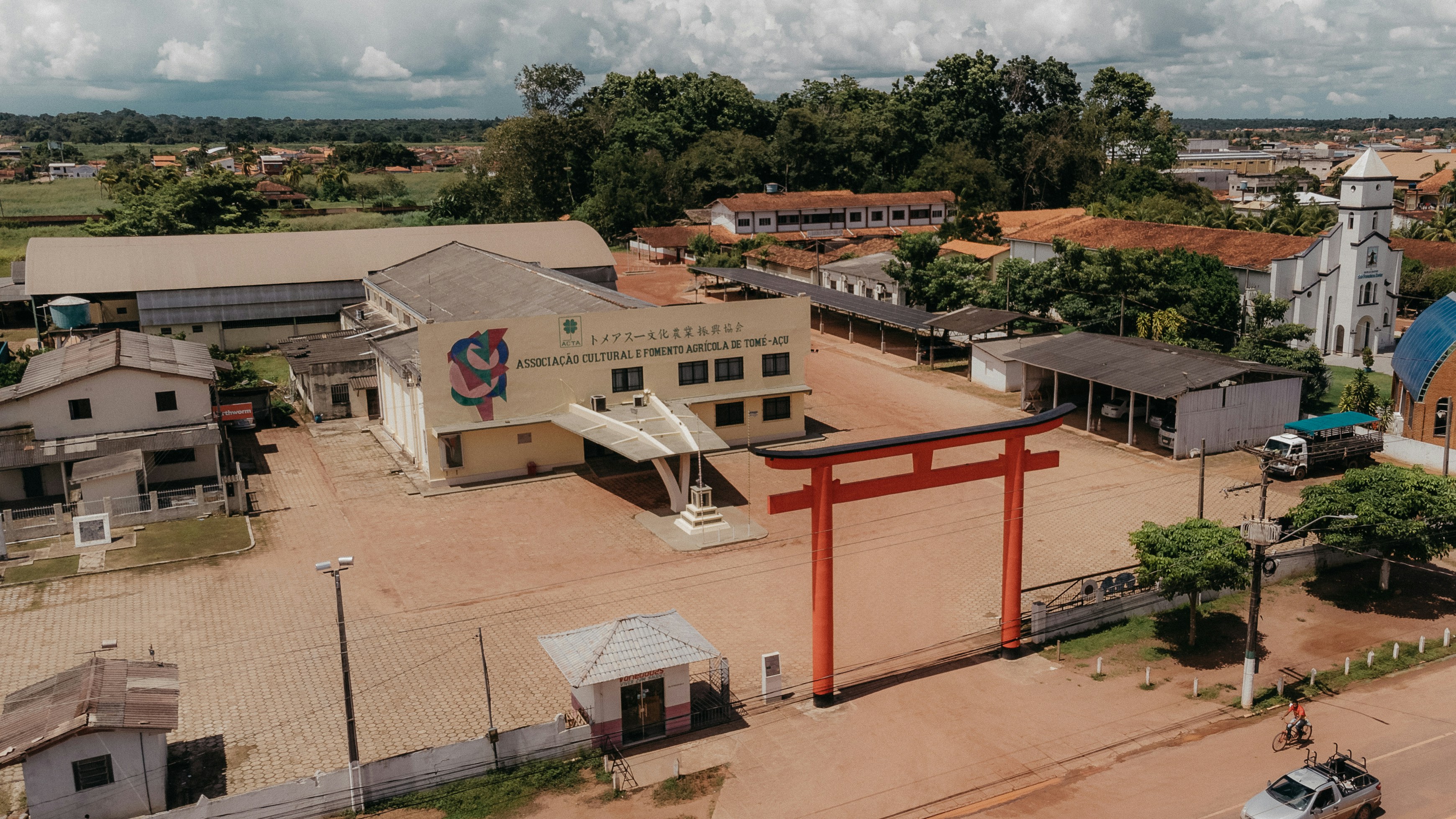 An aerial view of a town with a large red gate photo – Free Tori Image ...