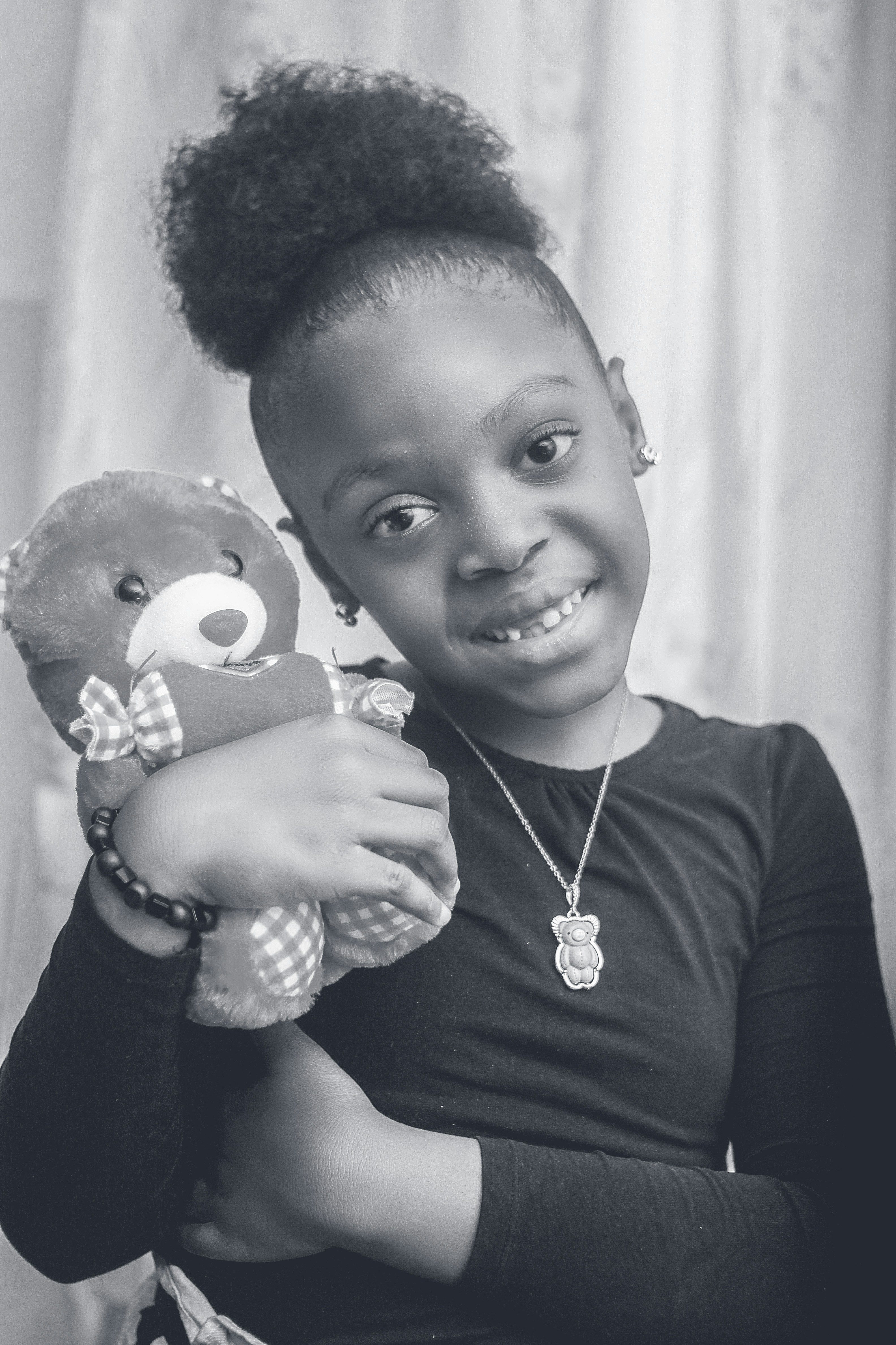 Quiet Grayscale Portrait: a girl with a teddy bear