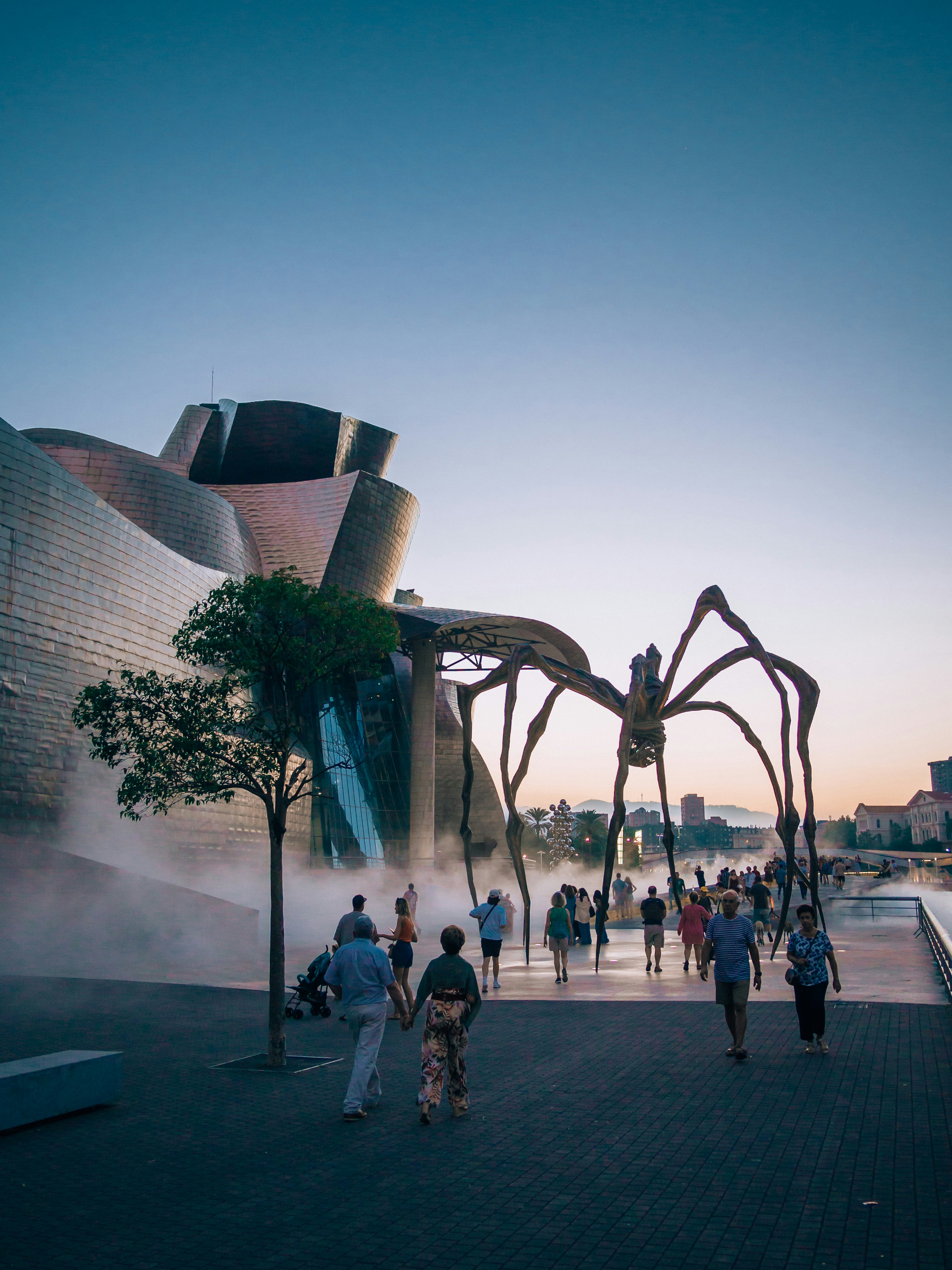 a giant spider sculpture in front of a building