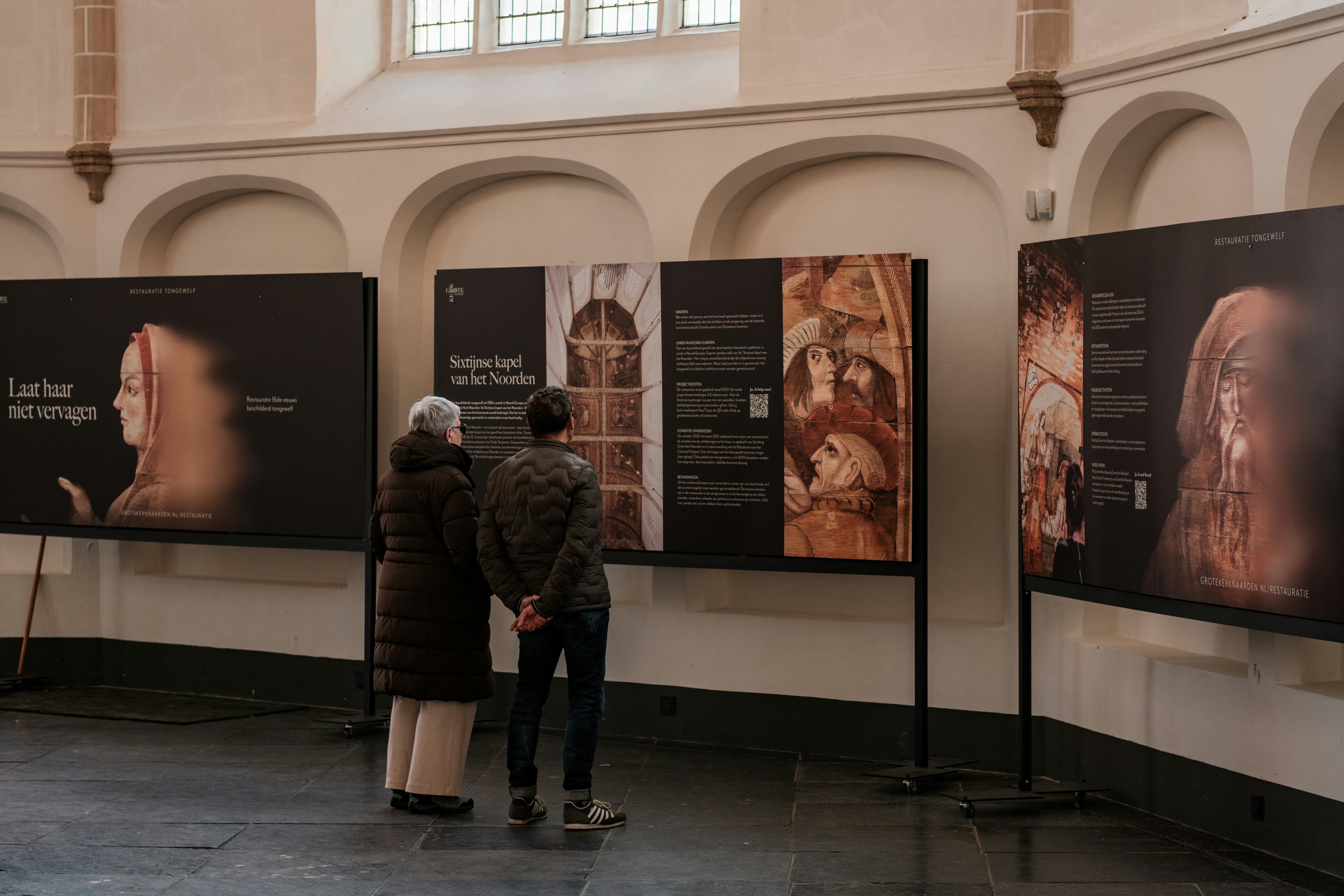 people in front of information panels