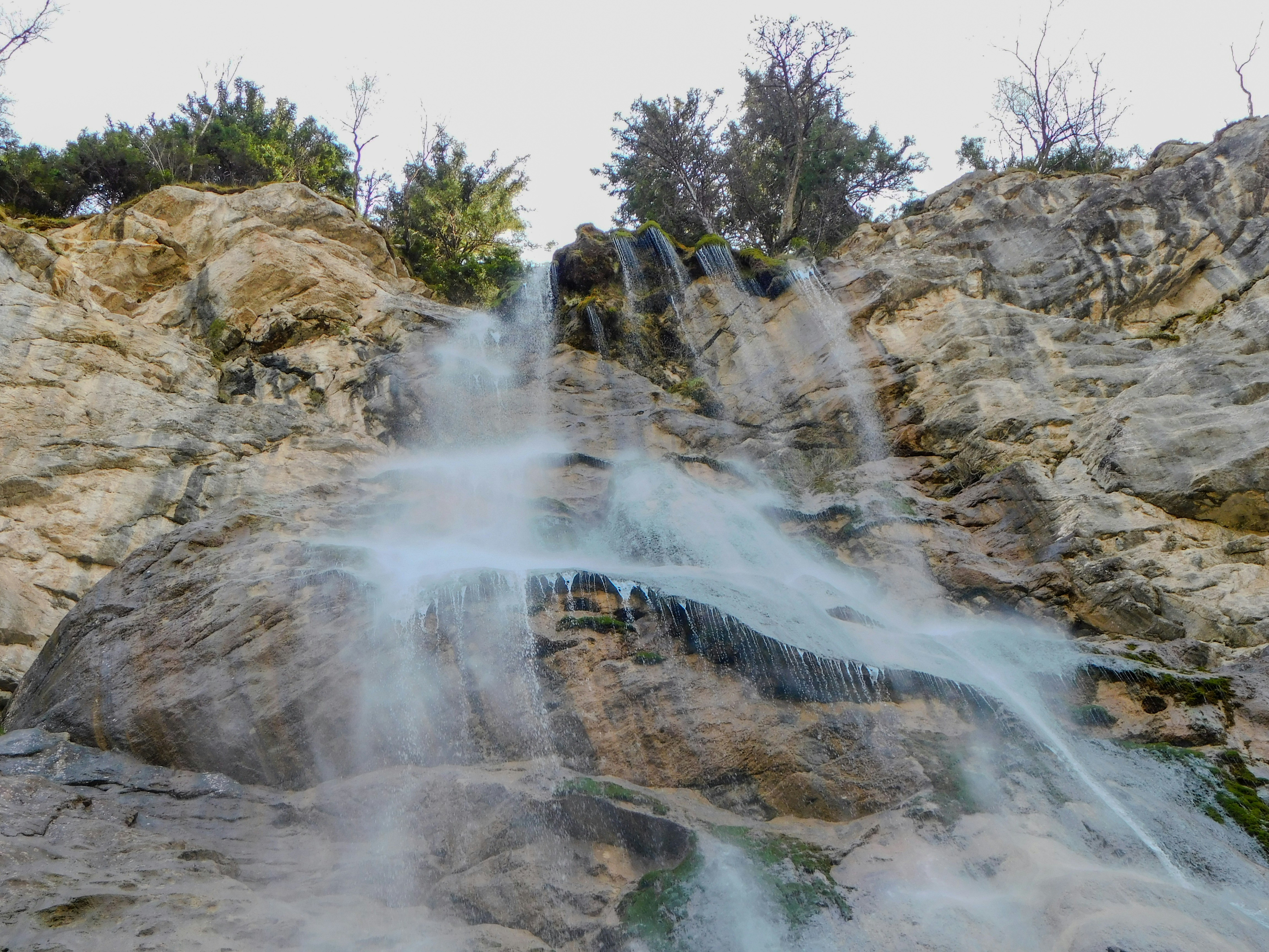 A very tall waterfall with lots of water coming out of it photo – Free ...