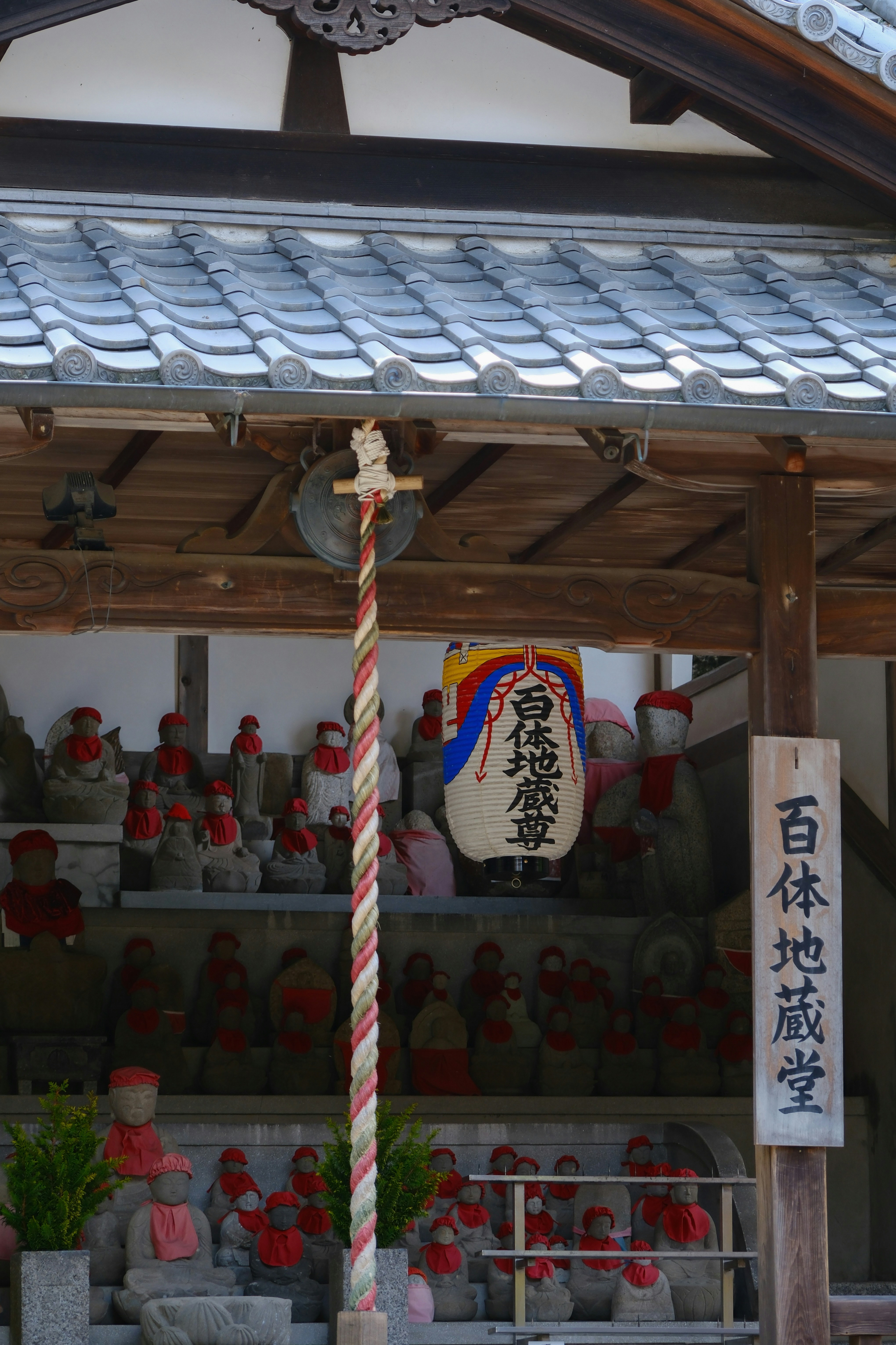 Lantern at the Heart of a Shrine of Red-Hooded Statues
