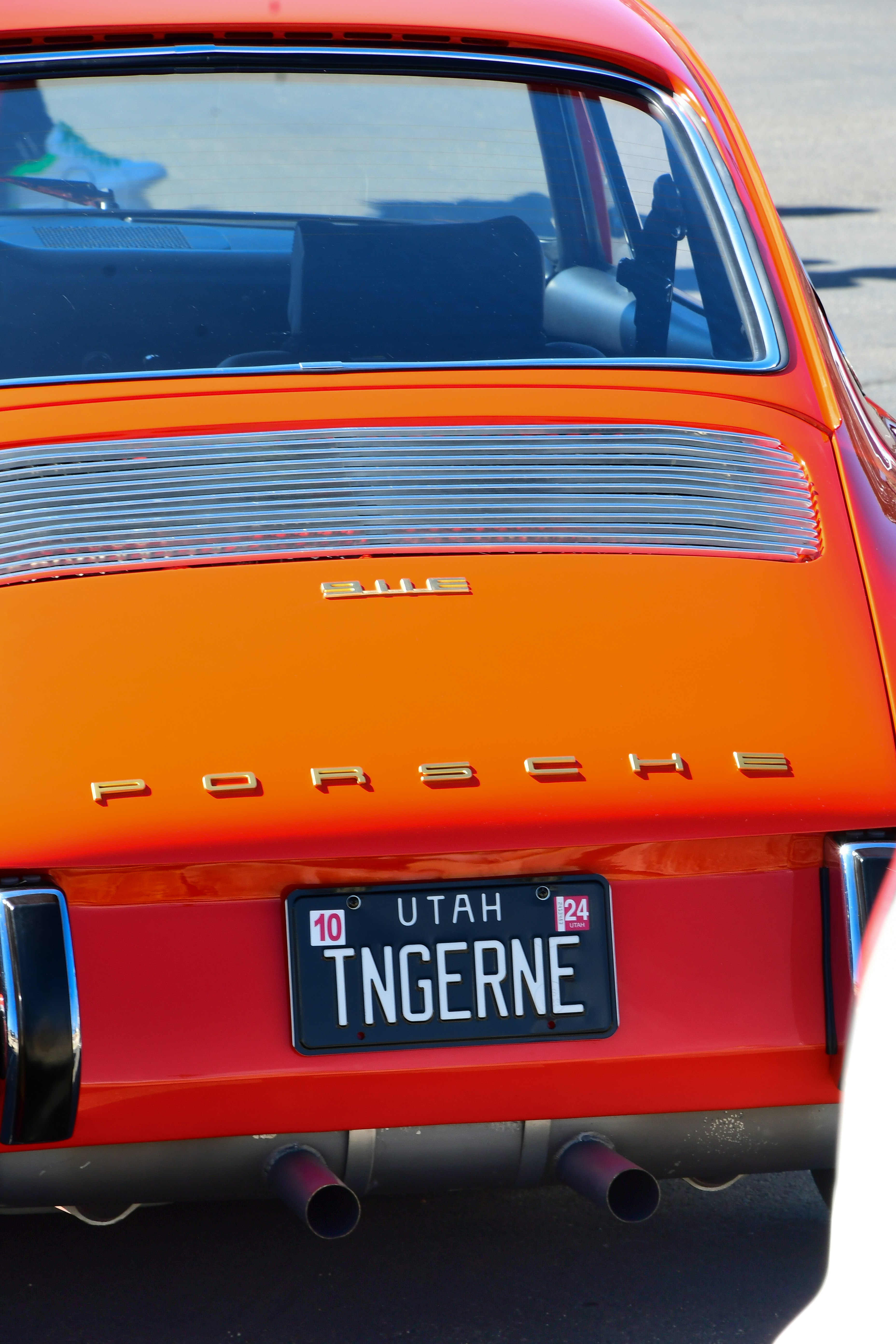 Rear-View Glow: An Orange Porsche with a Utah Plate