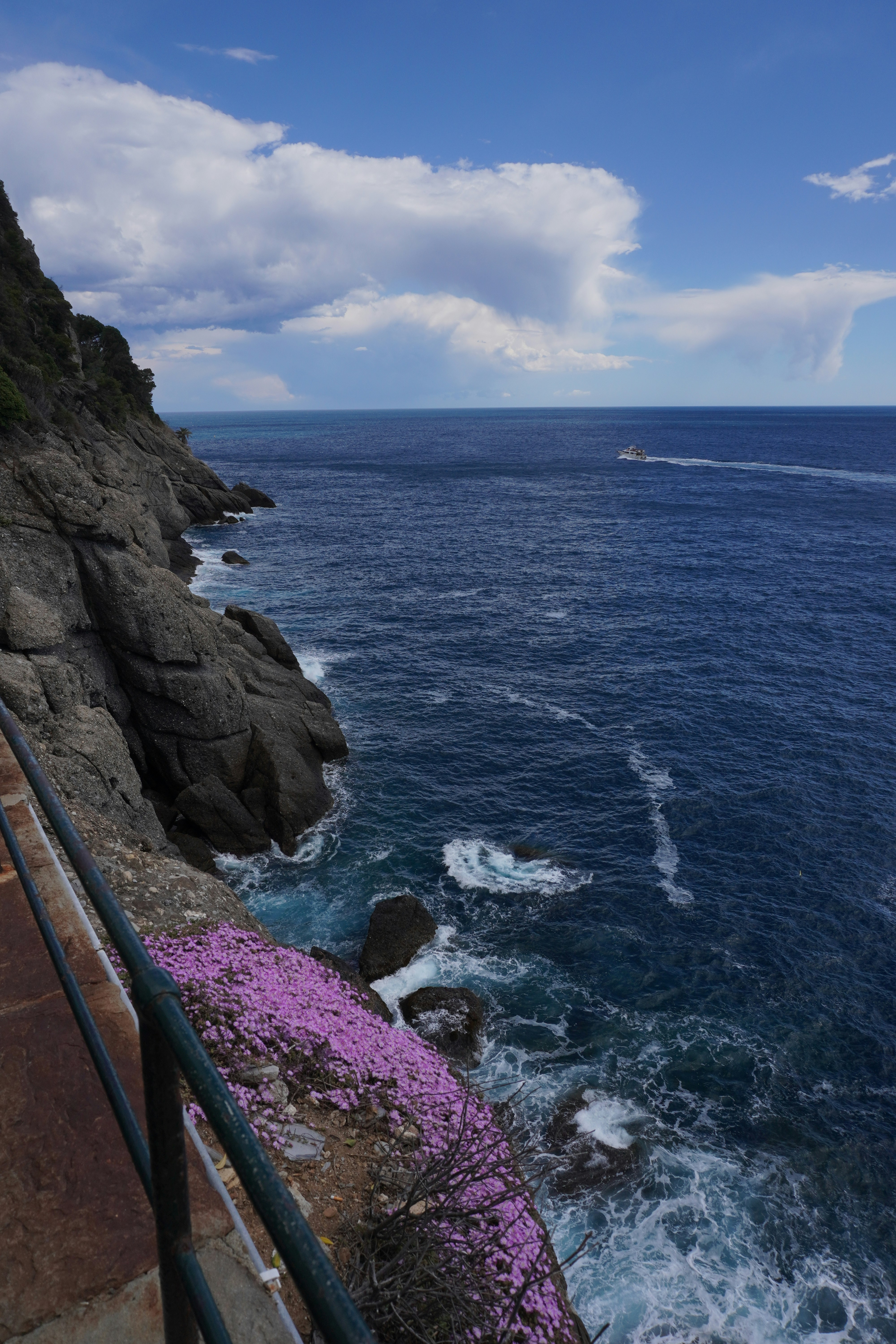 Rugged Cliffs Meet Open Ocean: A Balcony View Over the Sea