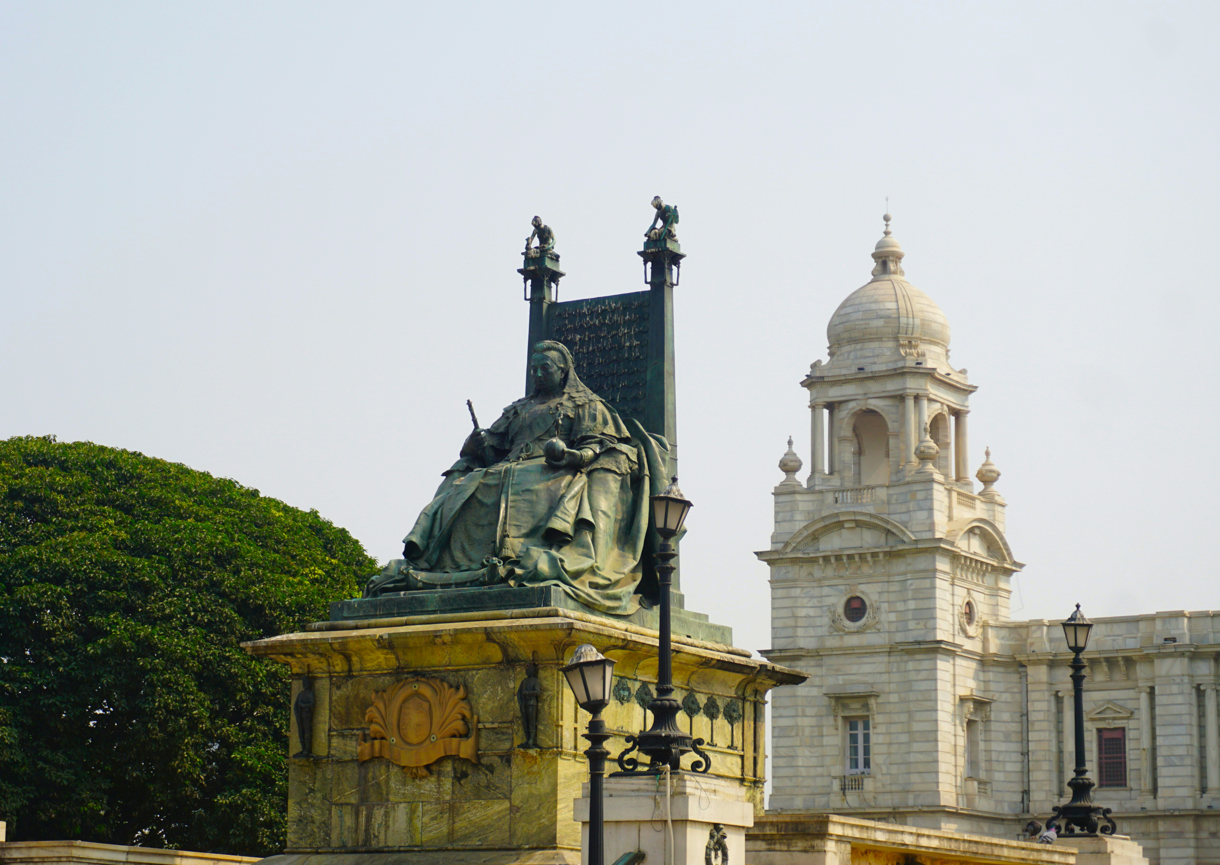 Equestrian Statue and Neoclassical Facade at a Sunlit Square
