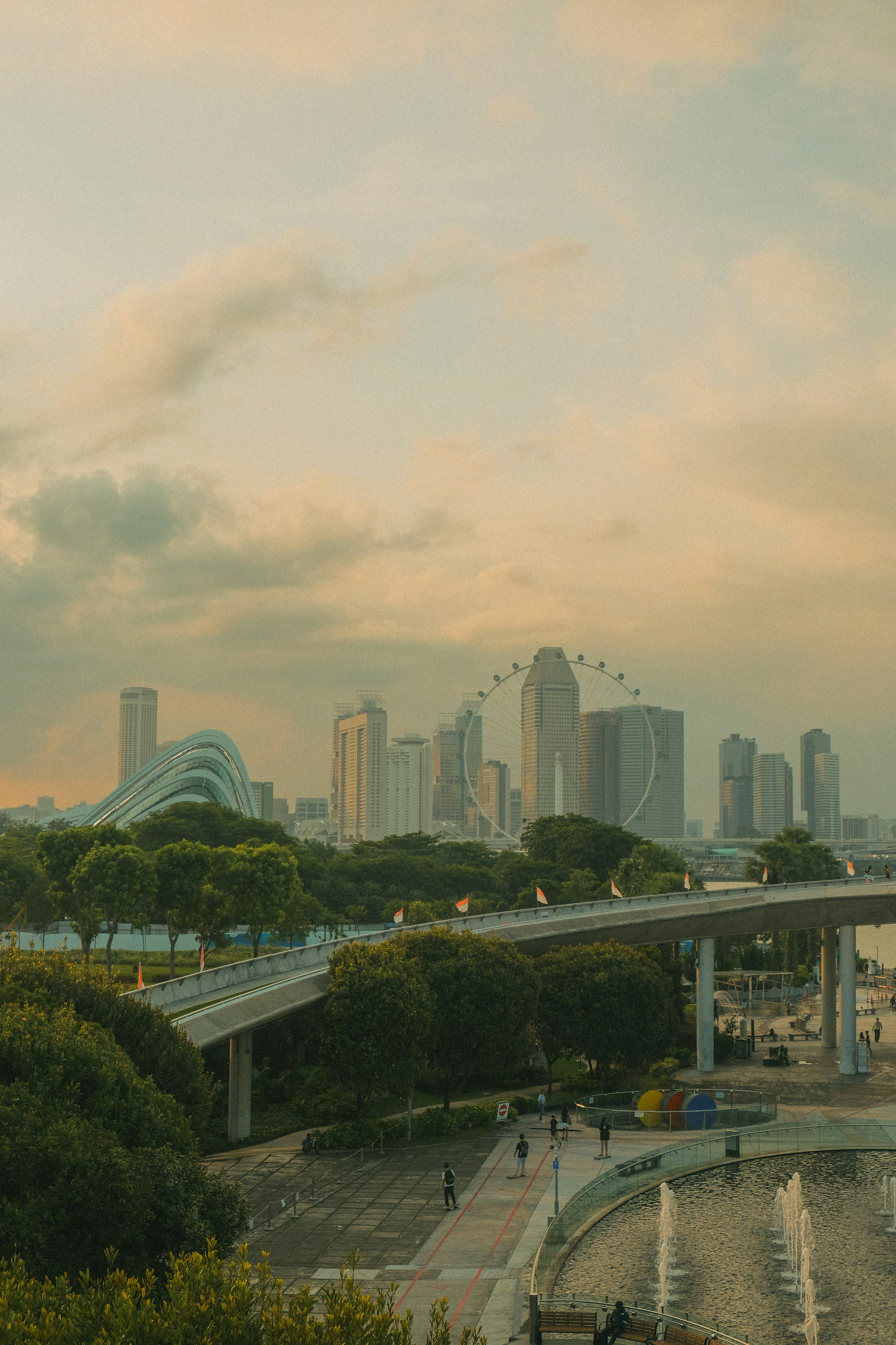 Dusk Over the Riverfront: A Ferris Wheel Frames the Modern Skyline