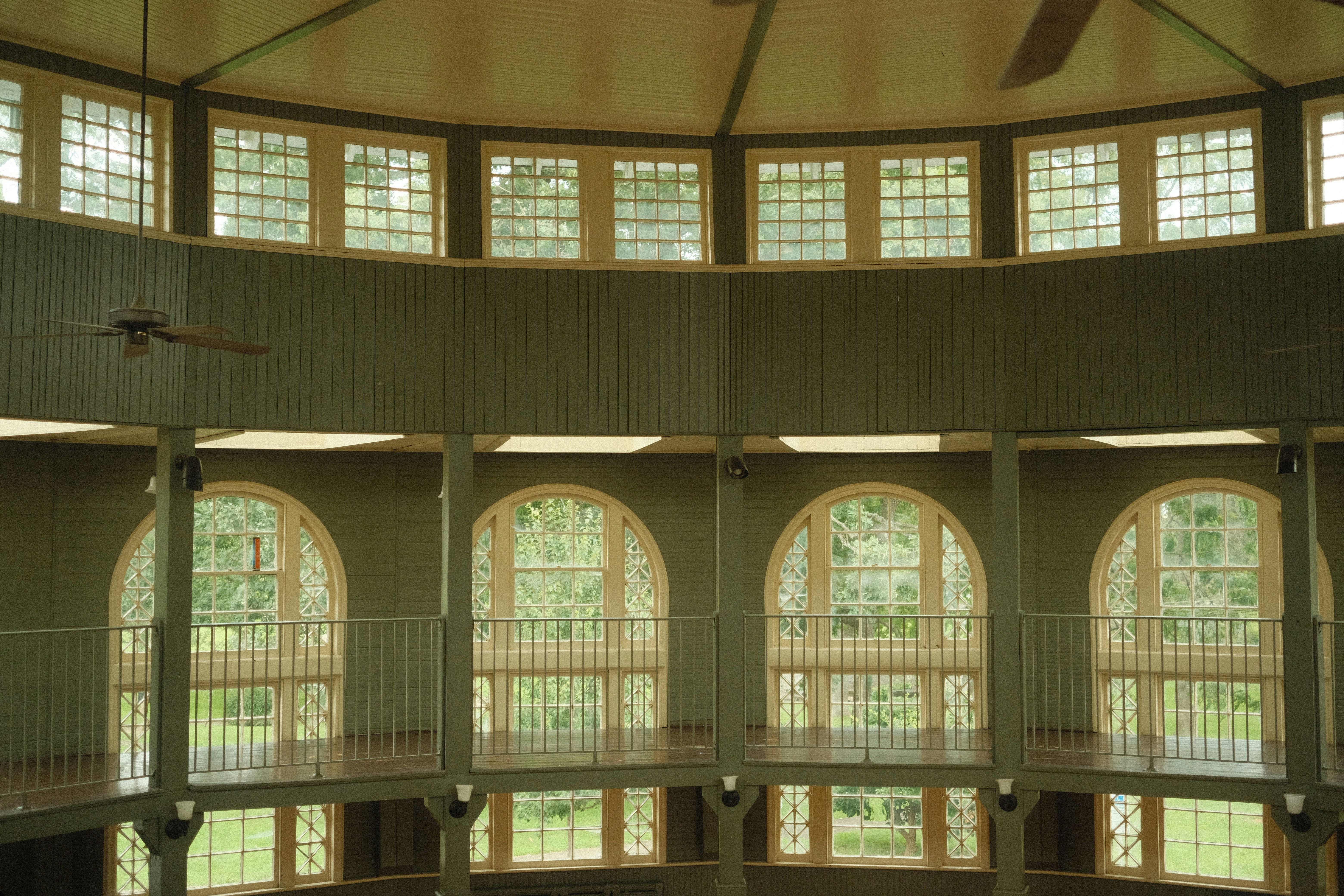 Circular Gallery Windows and Balcony in Sunlit Atrium