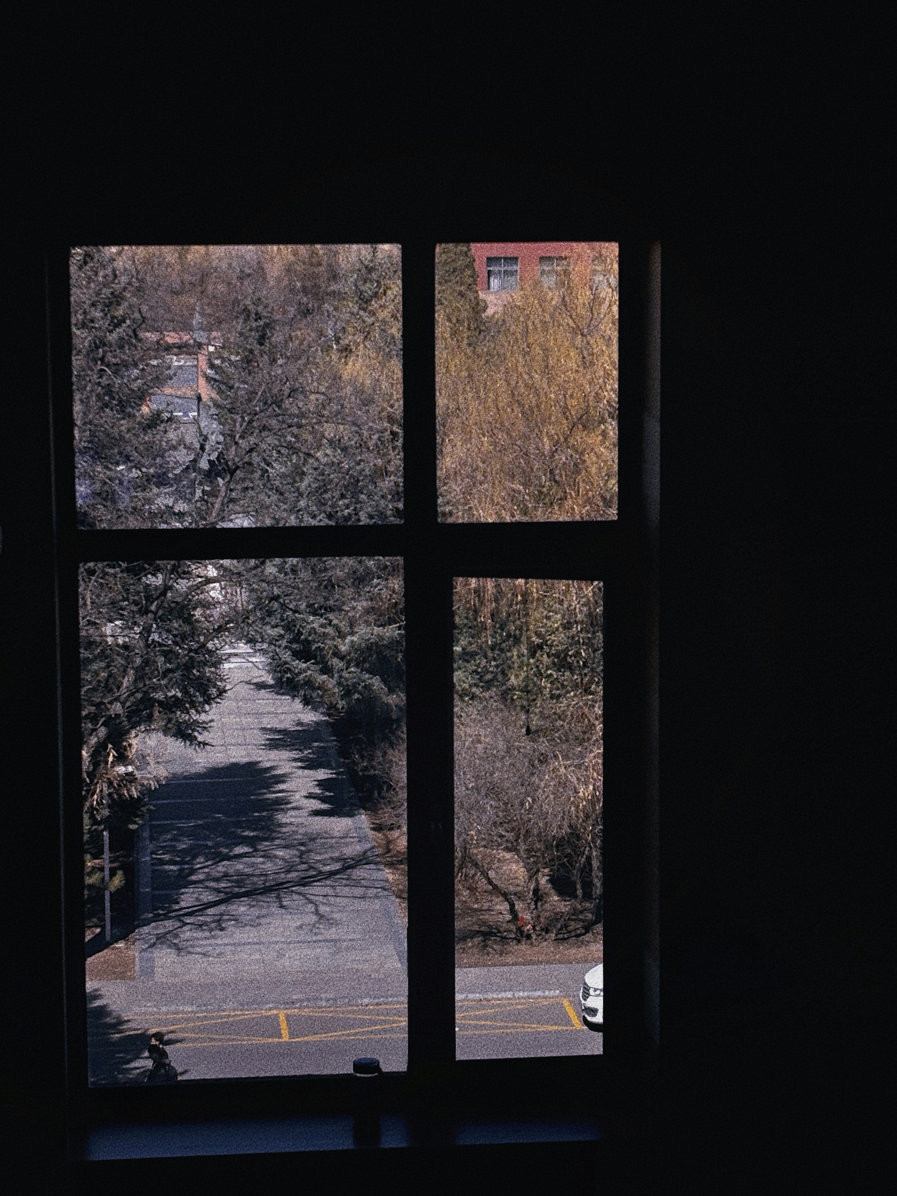 A view of a street from a window in a dark room photo – Free Inner ...