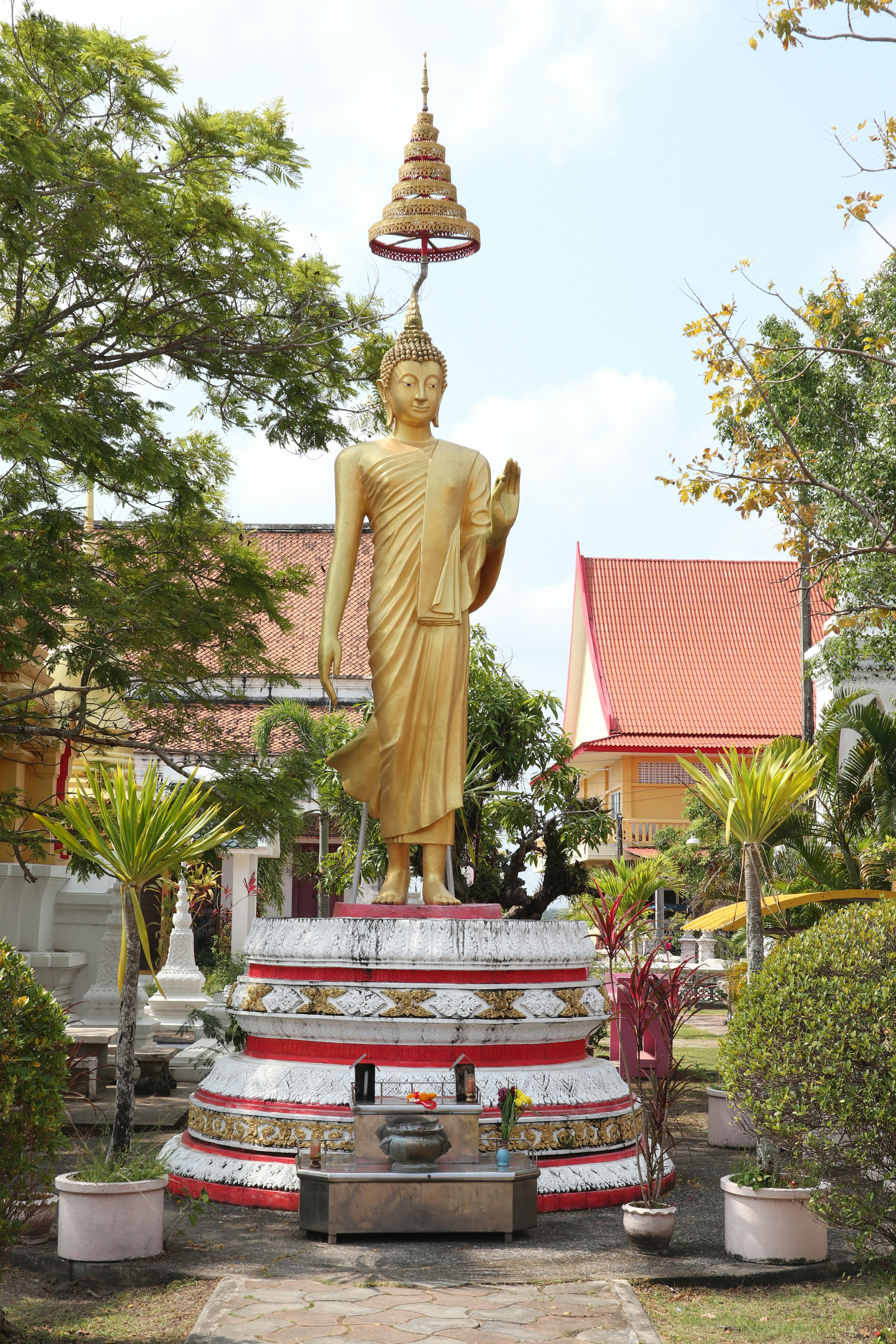 Sunlit Golden Buddha: Quiet Power in a Temple Courtyard