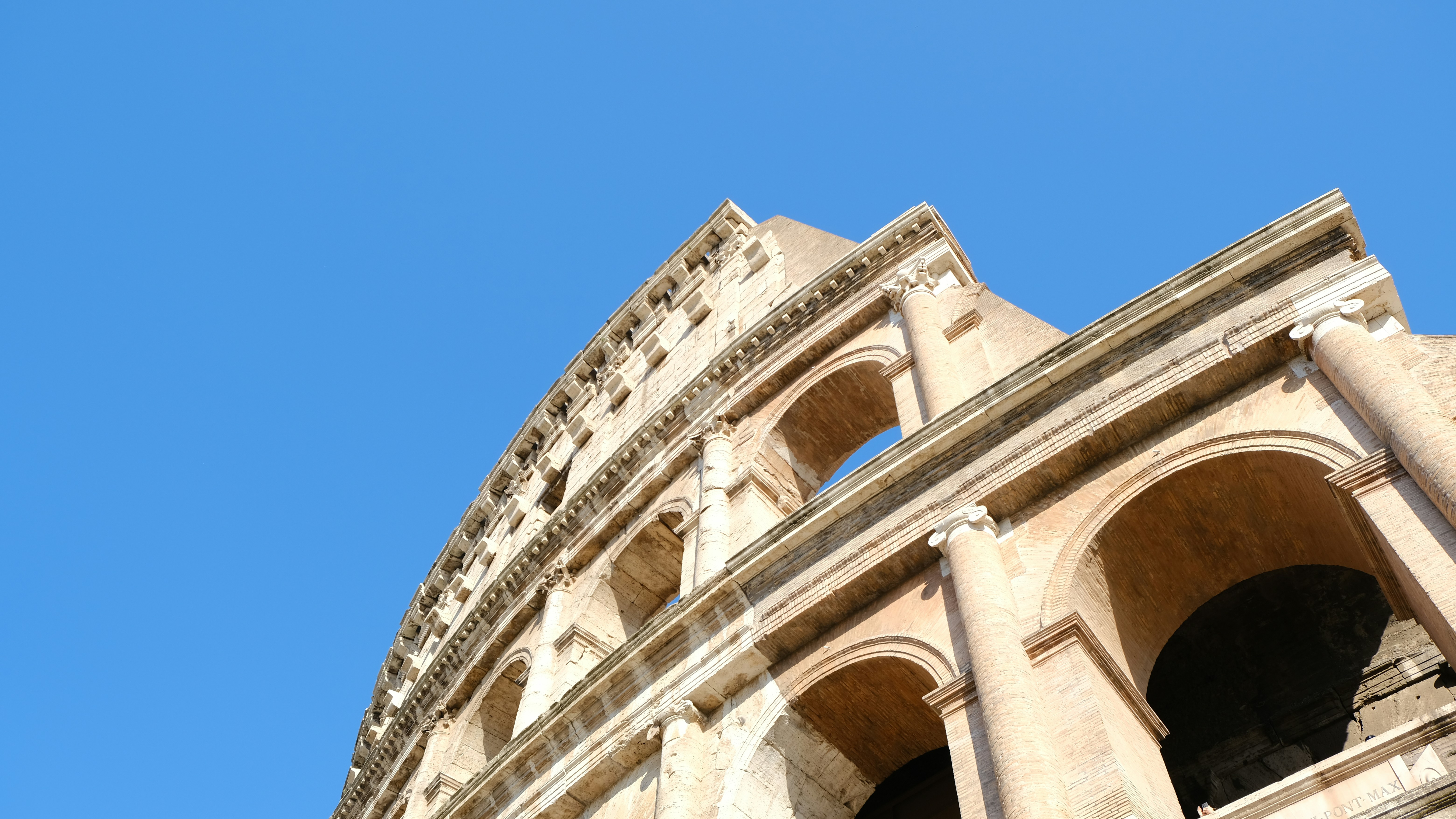 Cerulean Sky Framed by Time-Worn Arches