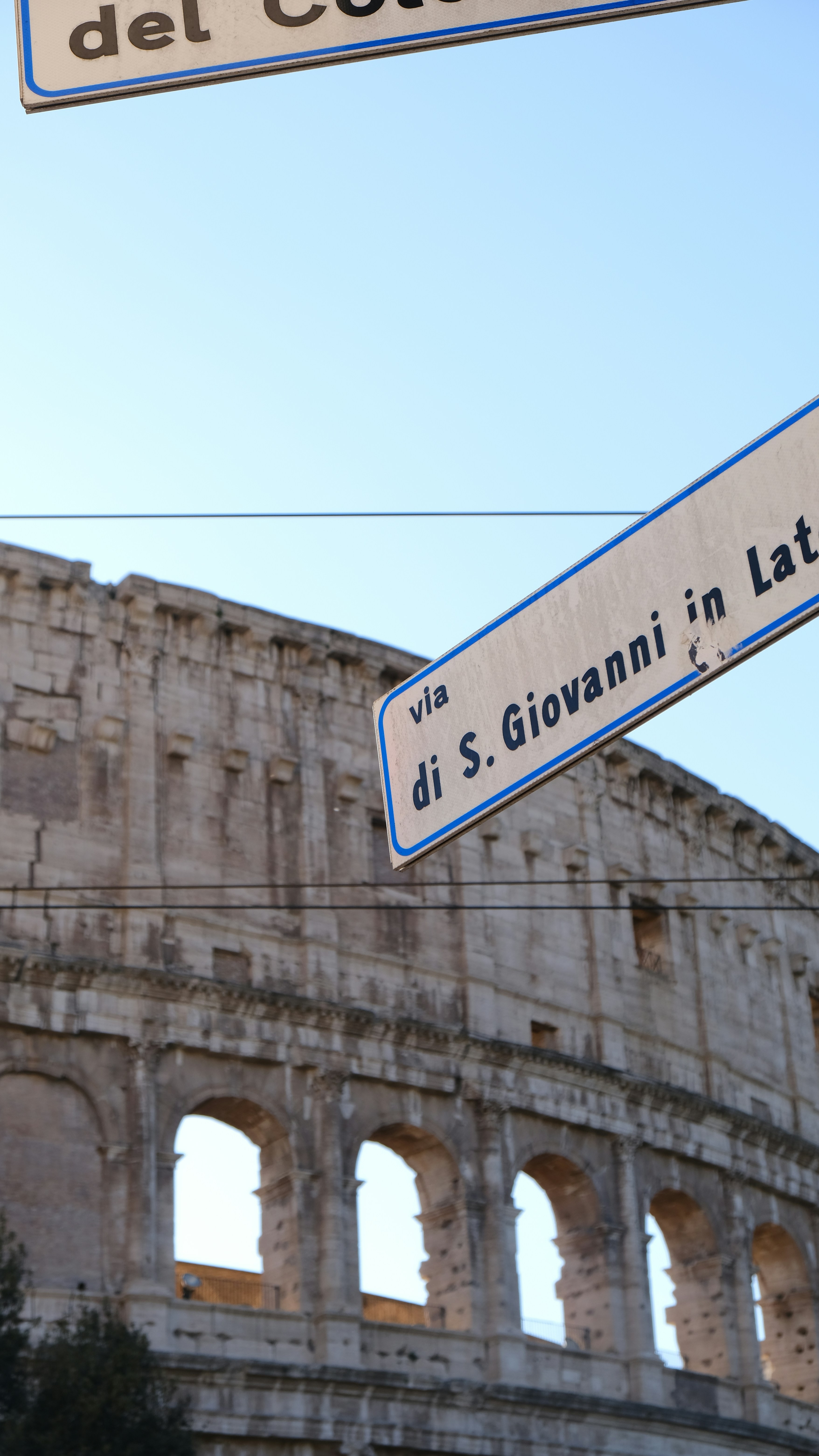 Street Signs Over Ancient Arches