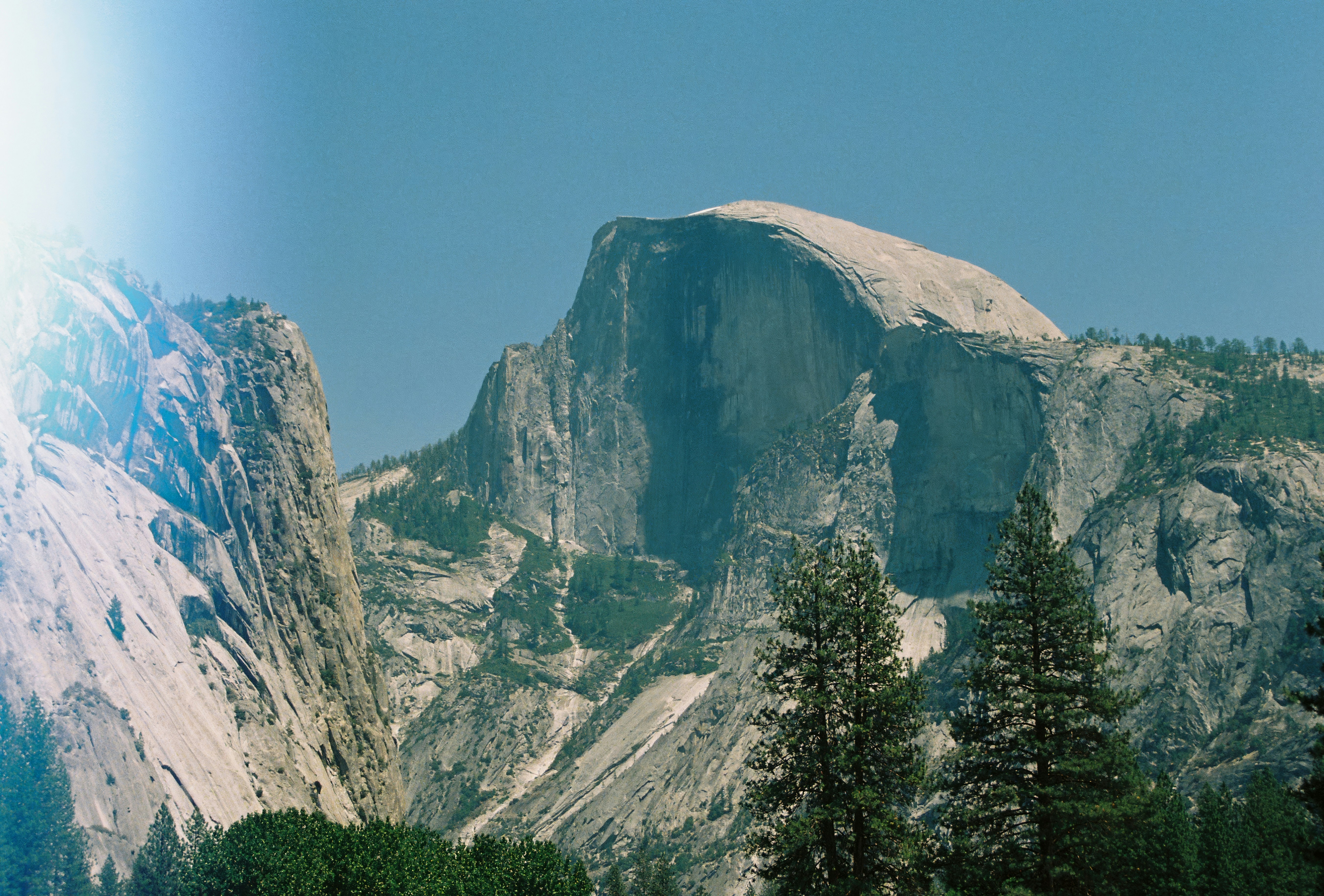 A mountain with a large rock in the middle of it photo – Free Yosemite ...