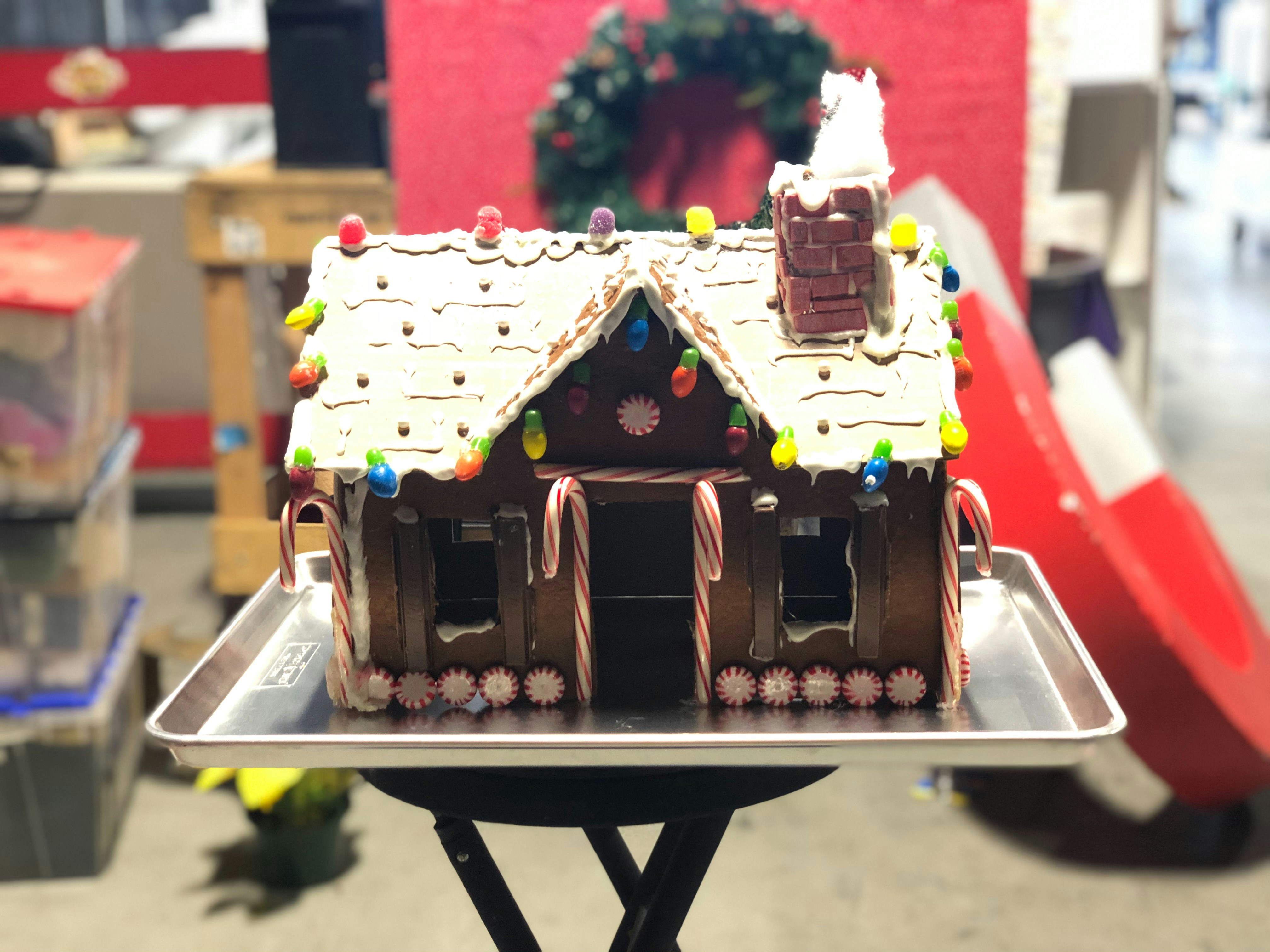 Candy-Sprinkled Gingerbread Chalet on a Silver Tray