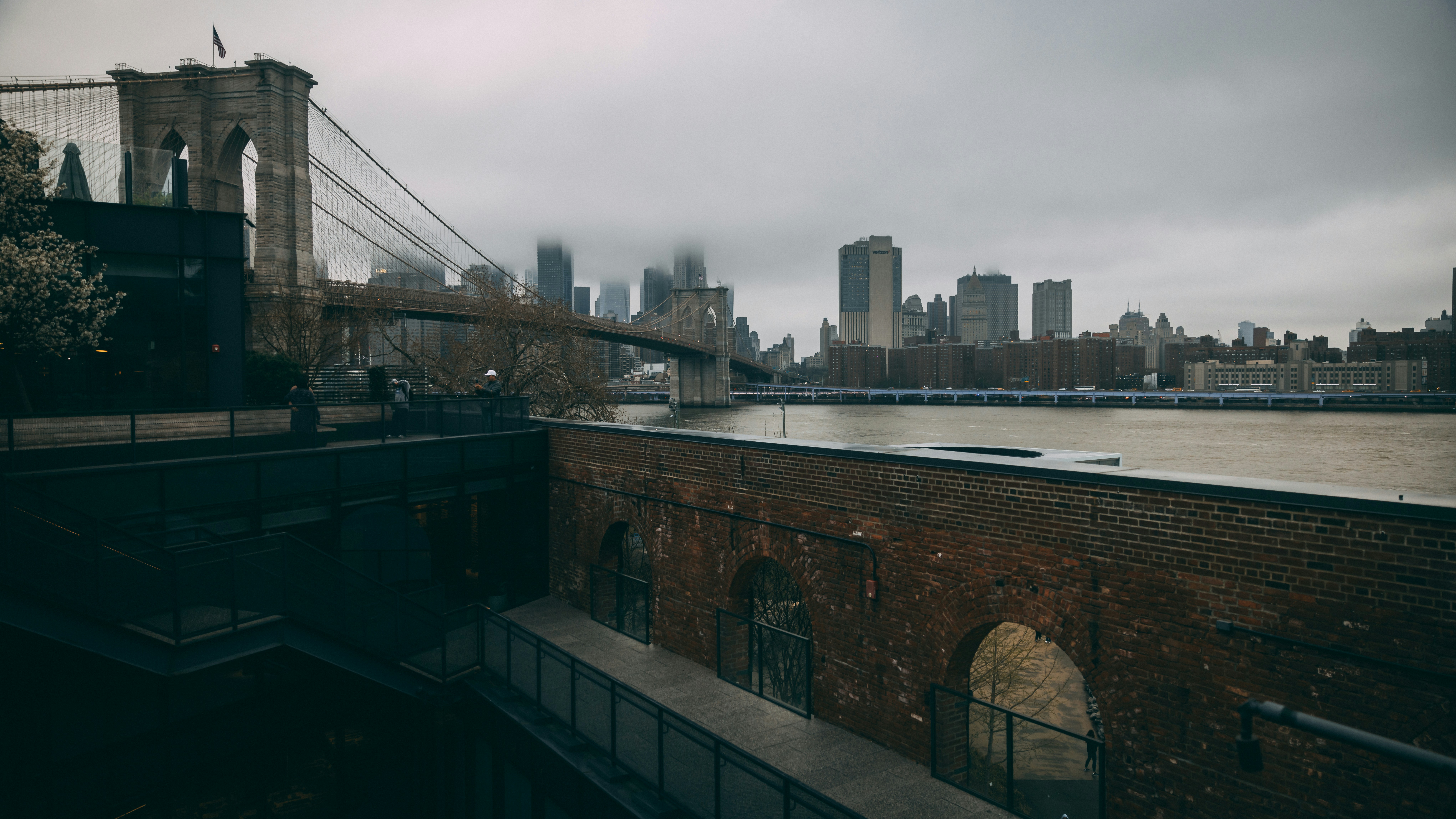 A view of the brooklyn bridge from a rooftop photo – Free Human Image ...
