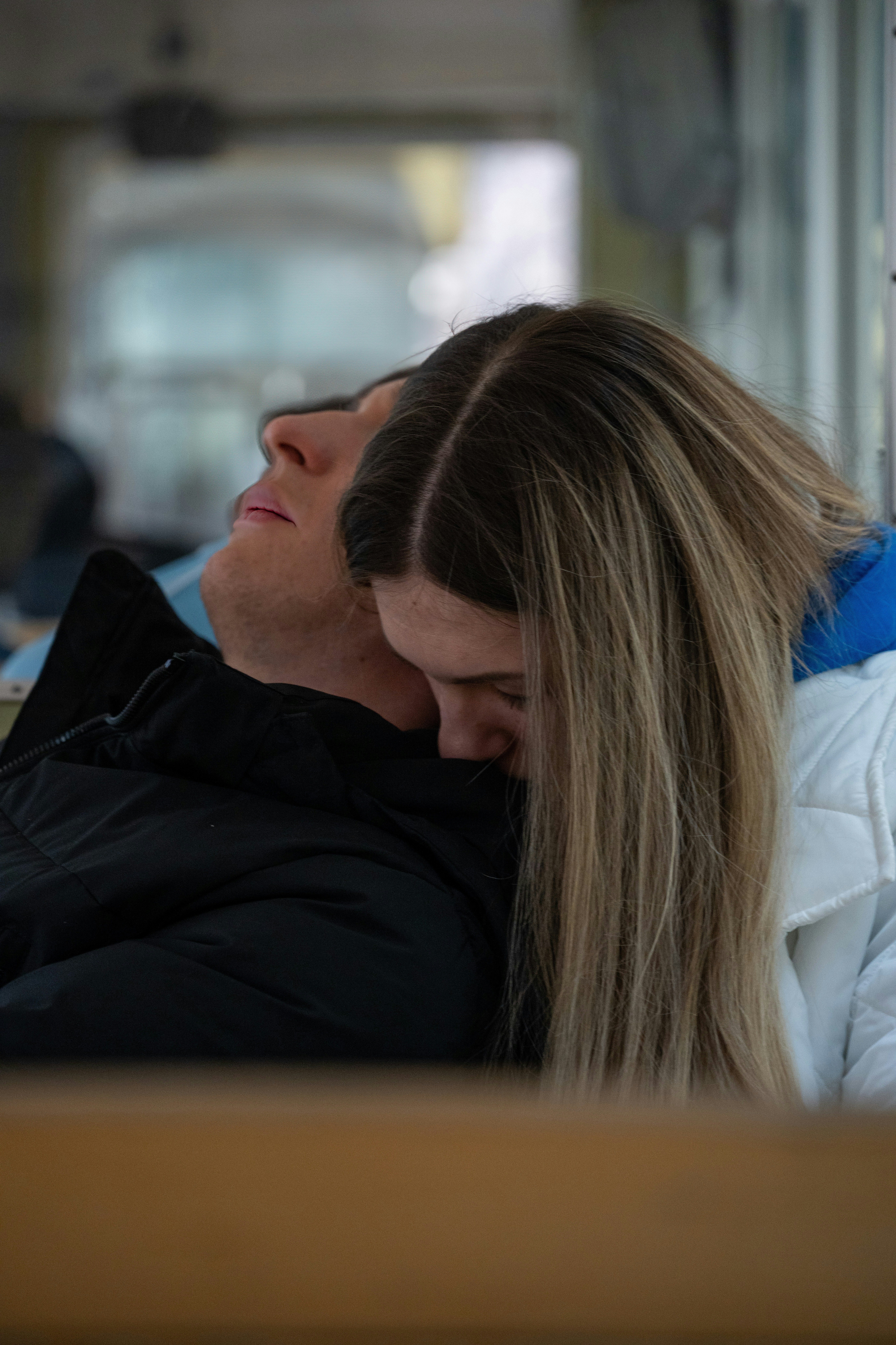 Quiet Embrace in Soft Light: A Shared Moment of Rest