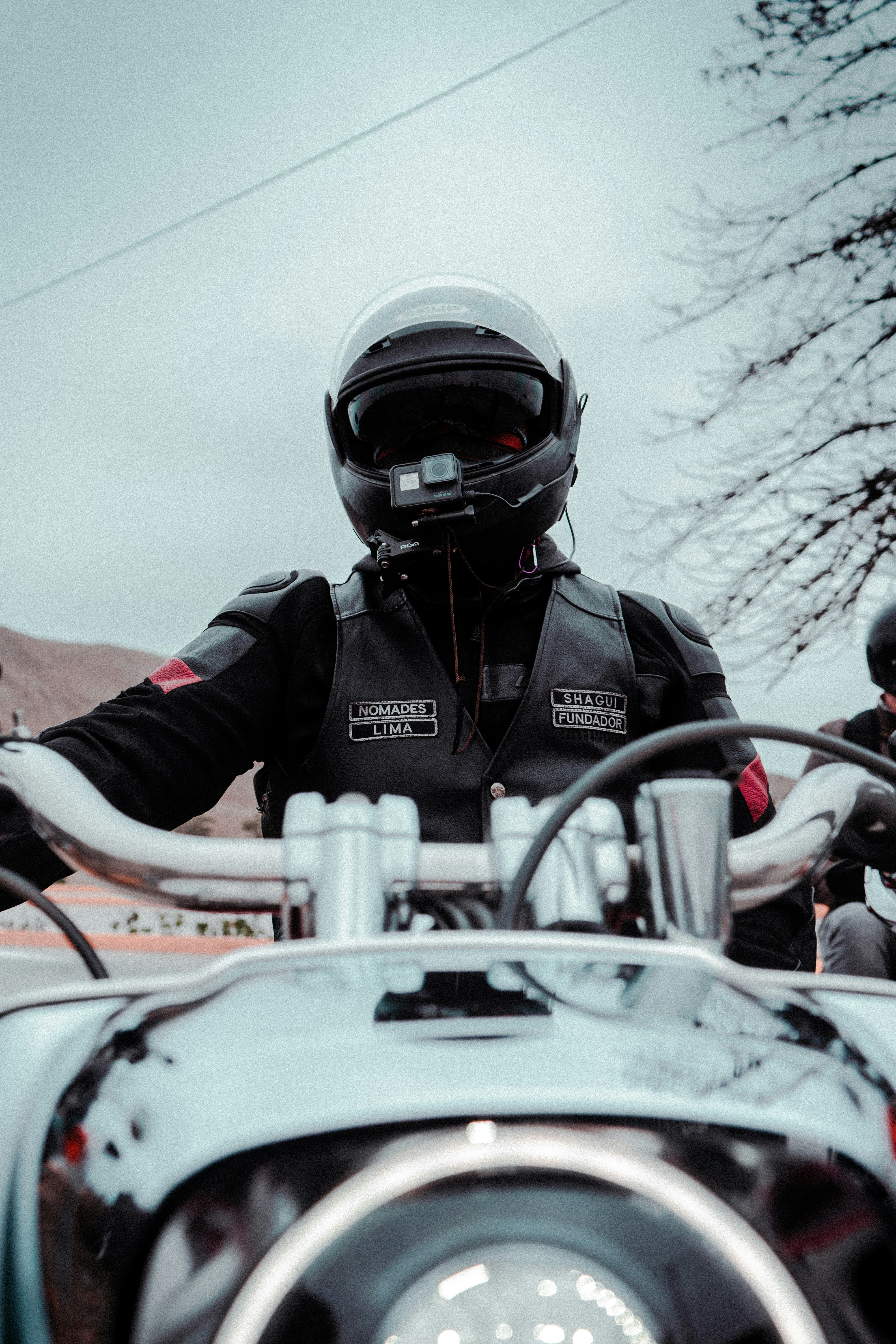 Motorcycle Helmeted Rider: Centered Gaze from the Open Road