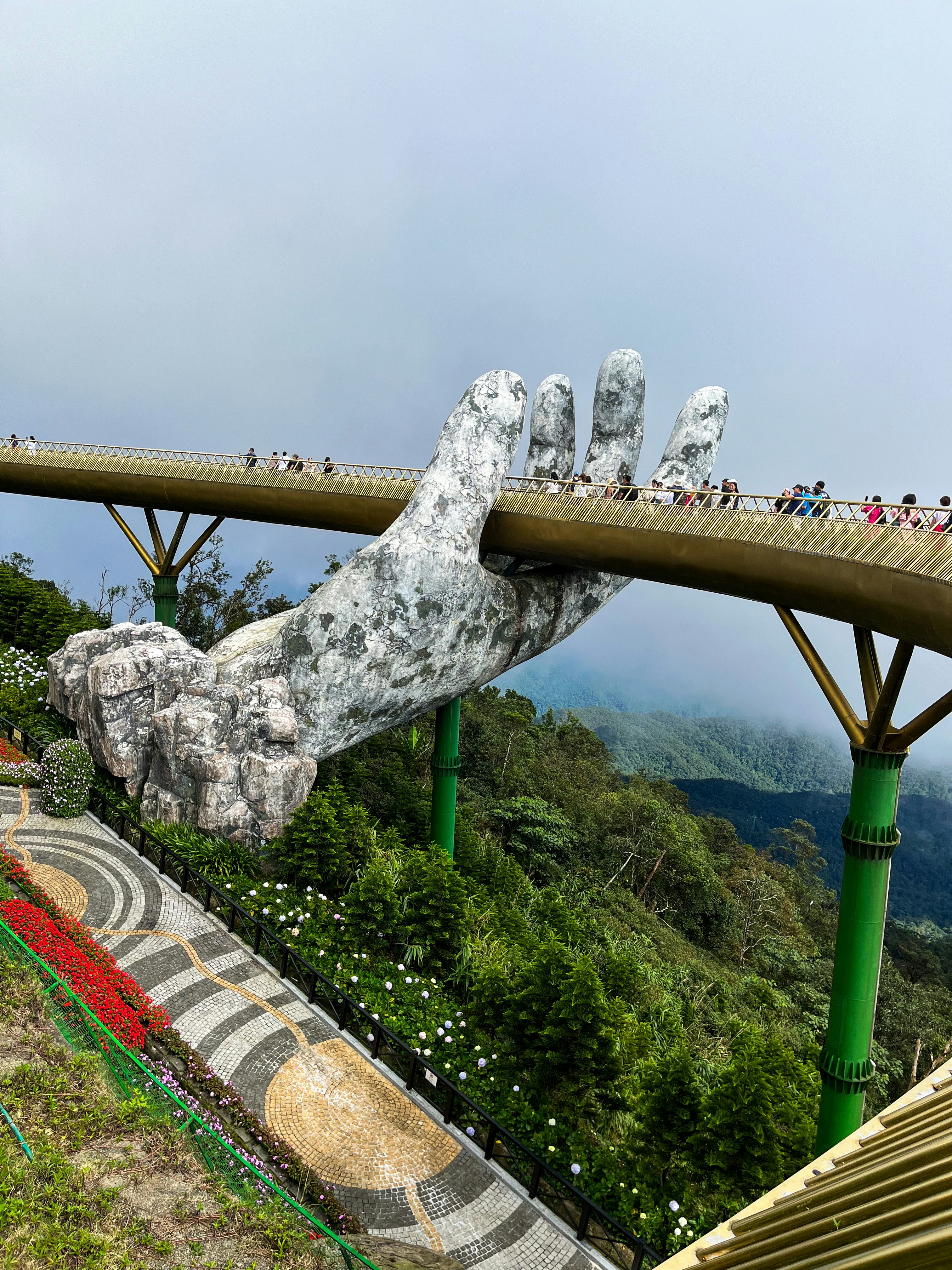A giant hand that is on top of a bridge photo – Free Bridge Image on ...