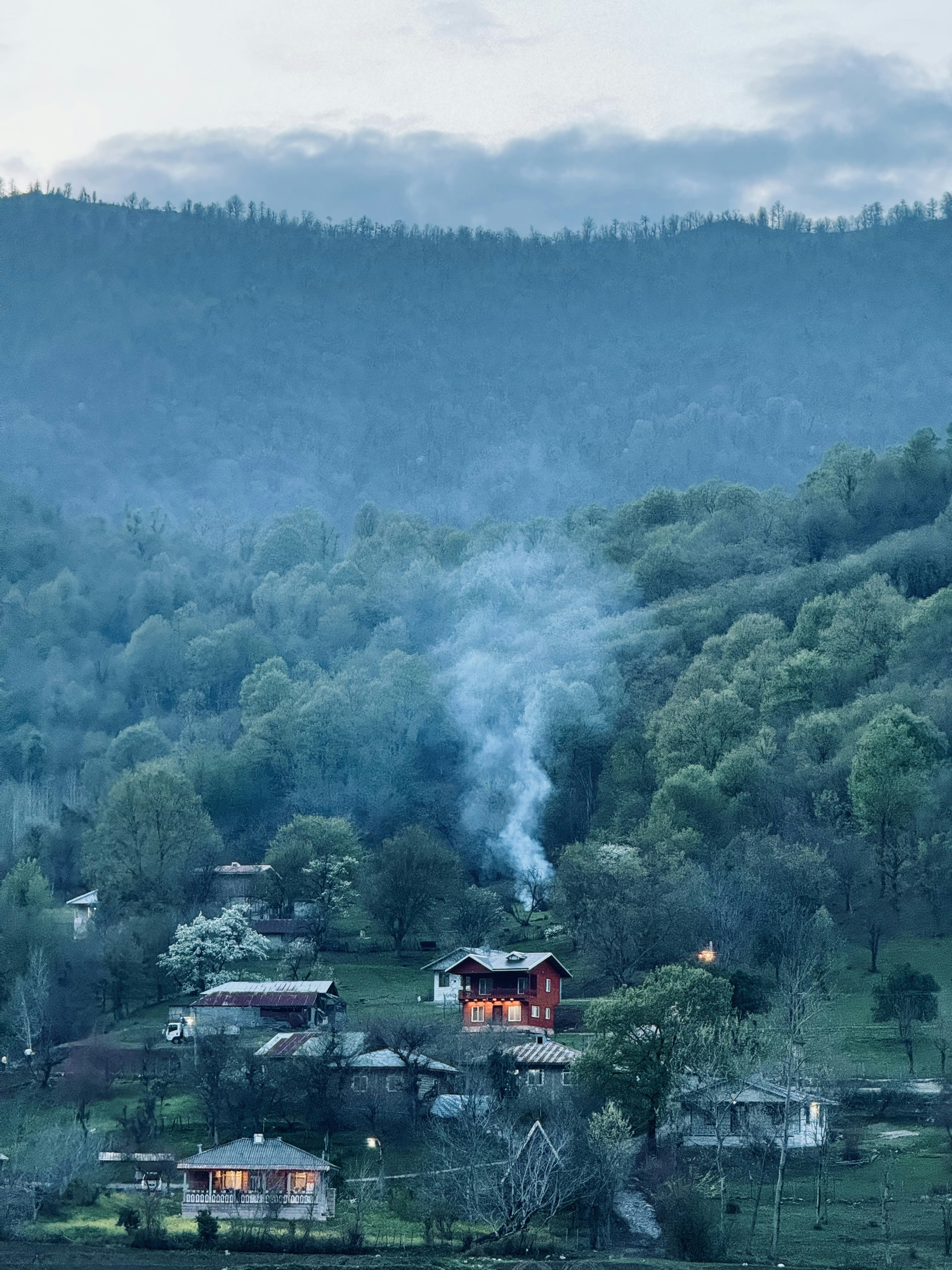 Crimson Cottage in a Veil of Blue Mist