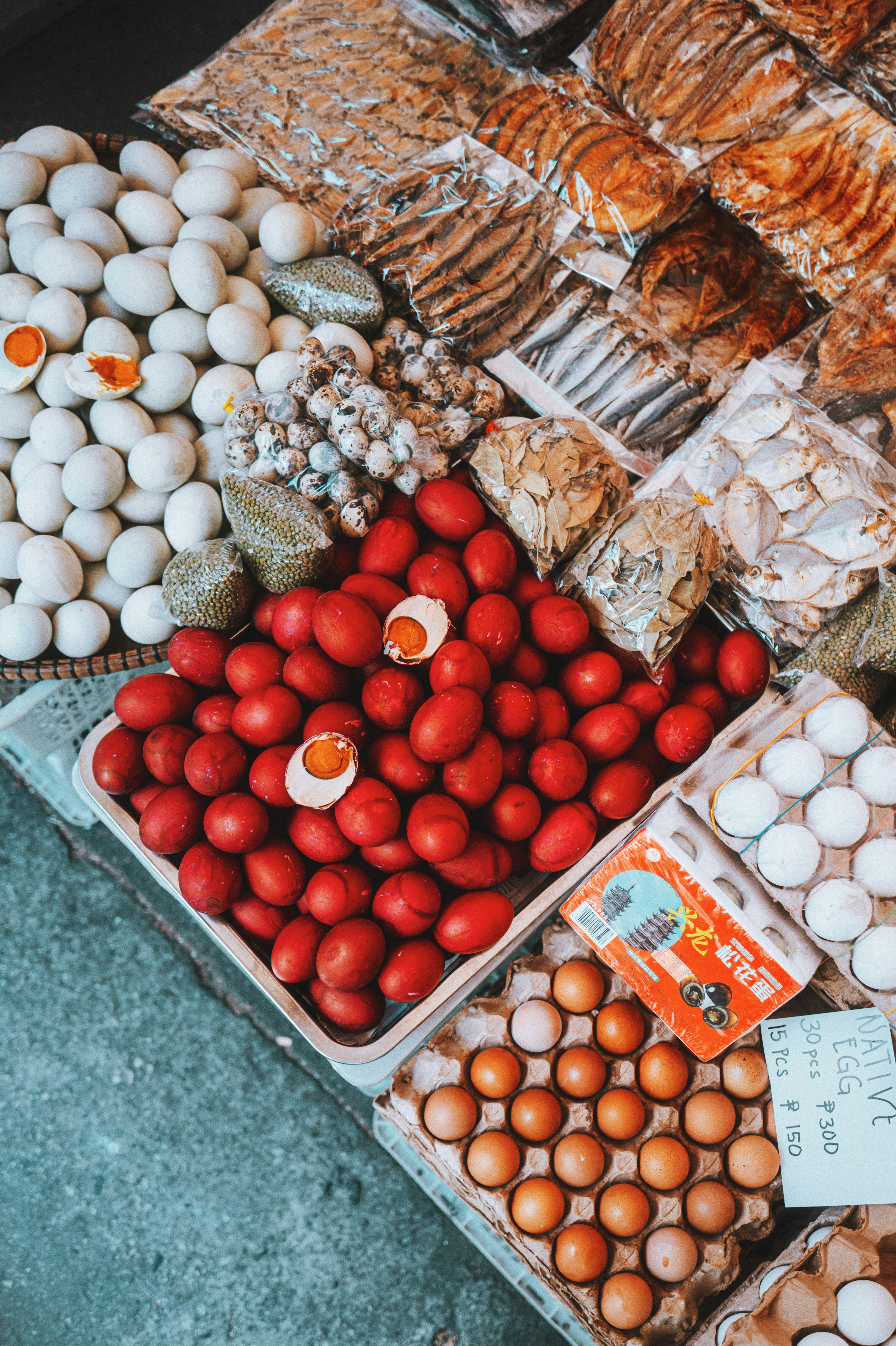 Market Bounty: A Palette of Eggs and Pastries on a Fresh Morning Stall
